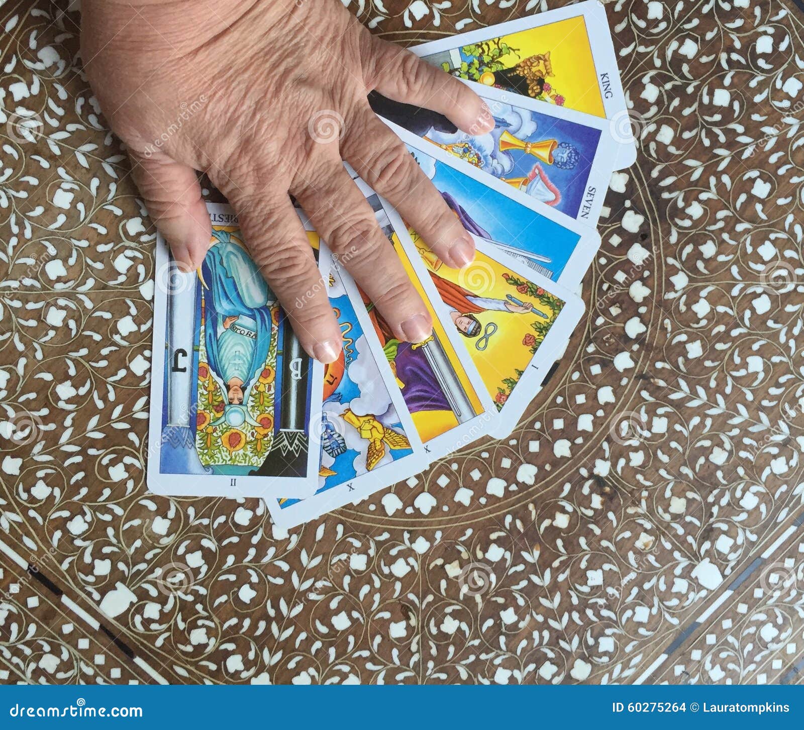 Hand on Tarot Cards stock photo. Image of readings, hands - 60275264