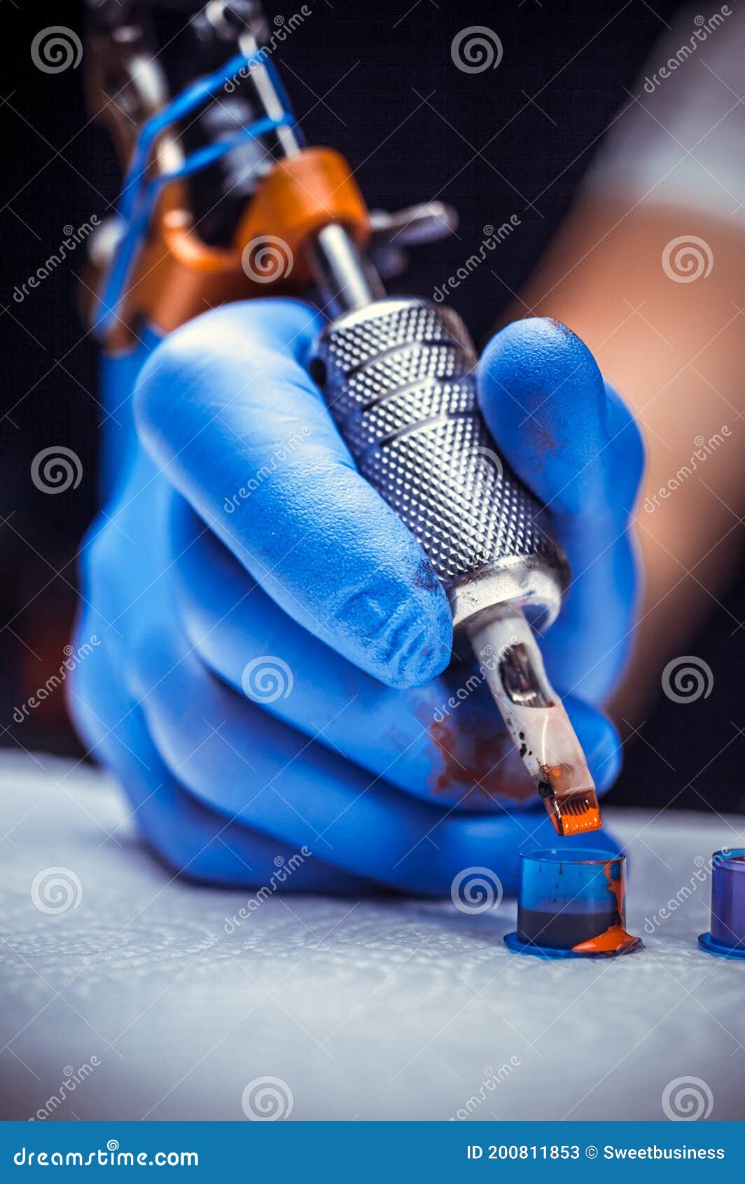 Hand of a Tattoo Artist, Holding the Tattoo Gun. Stock Image - Image of ...