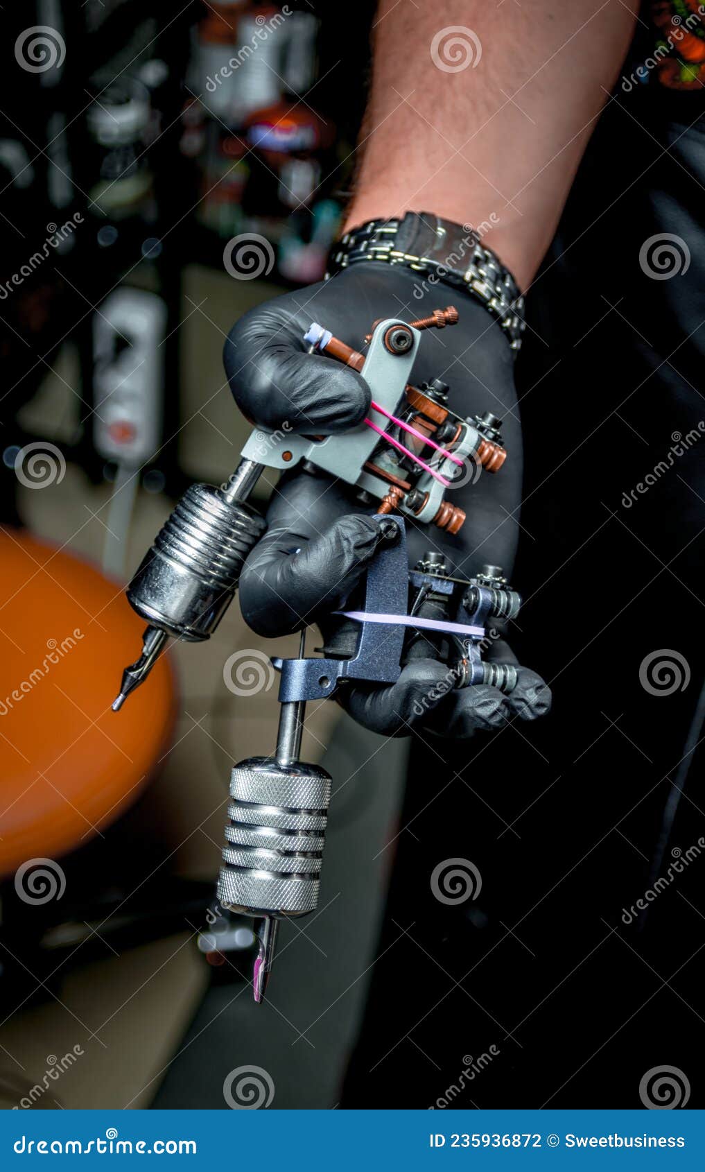 Hand of Tattoo Master and a Tattoo Machine. Stock Photo - Image of ...