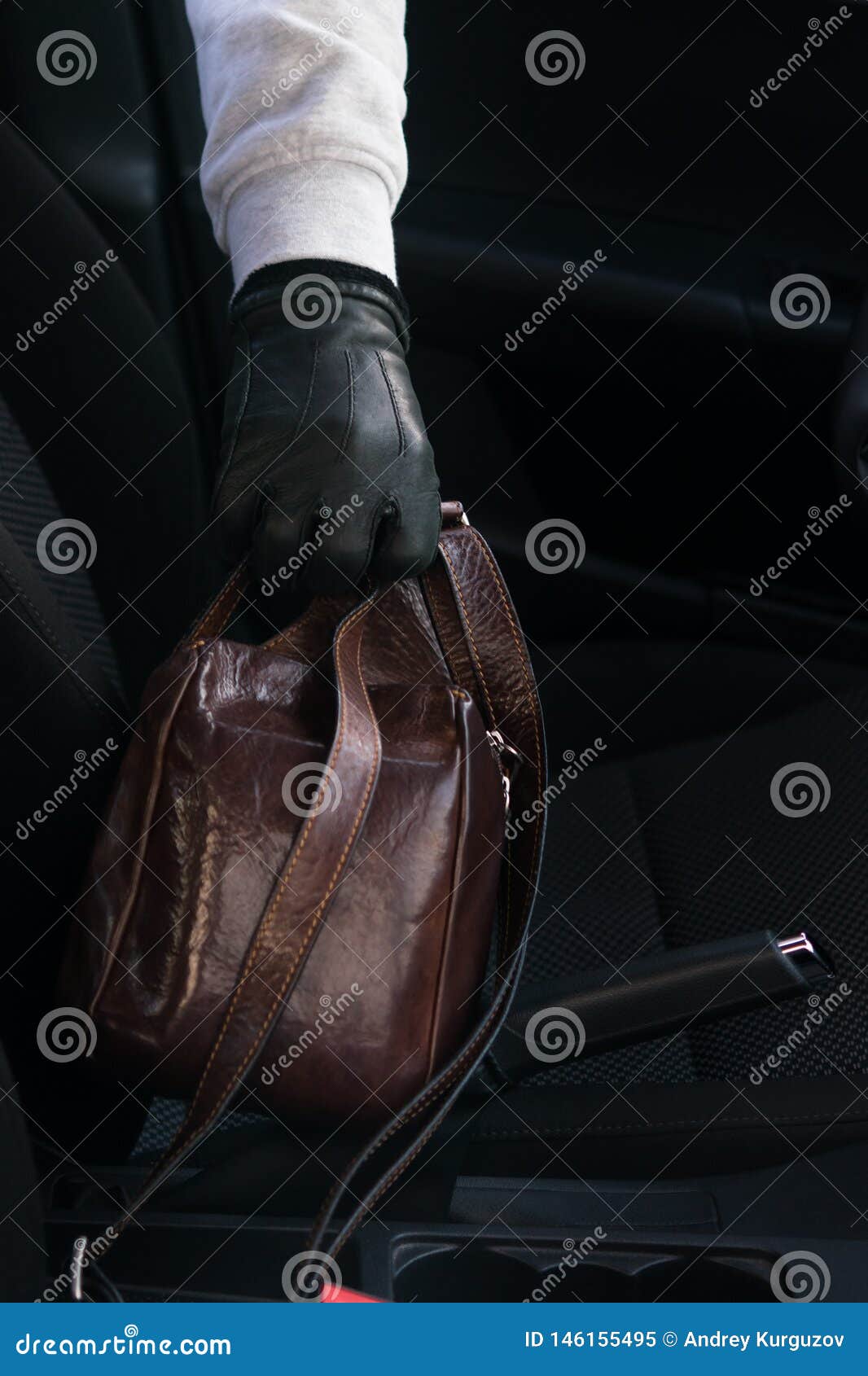 Hand of a Thief Steals a Bag of Documents from the Car, Close-up Stock ...