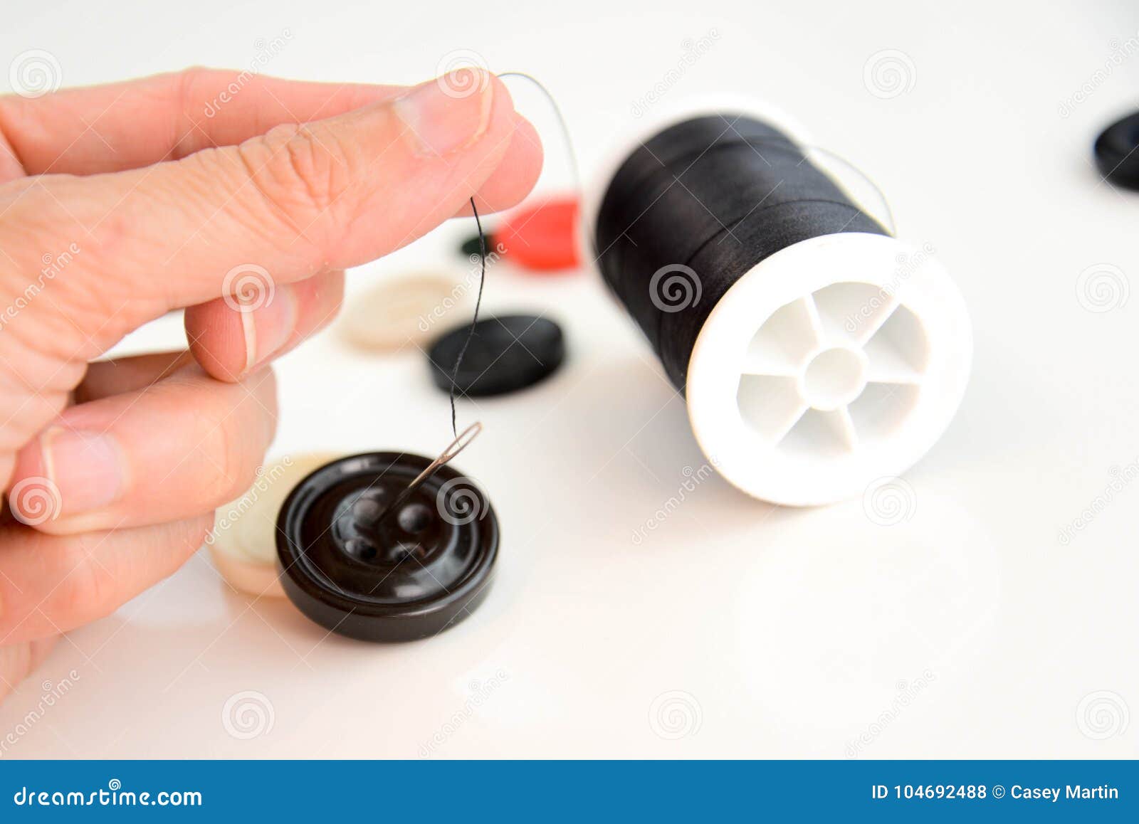 Hand Threading a Needle with Black Thread Stock Photo - Image of stitch ...