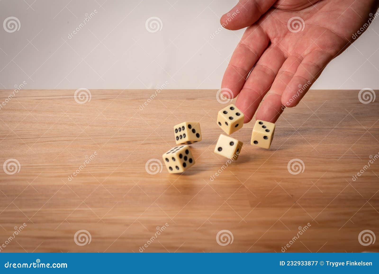 Hand Throwing Five Dice on a Wooden Table Stock Image - Image of ...