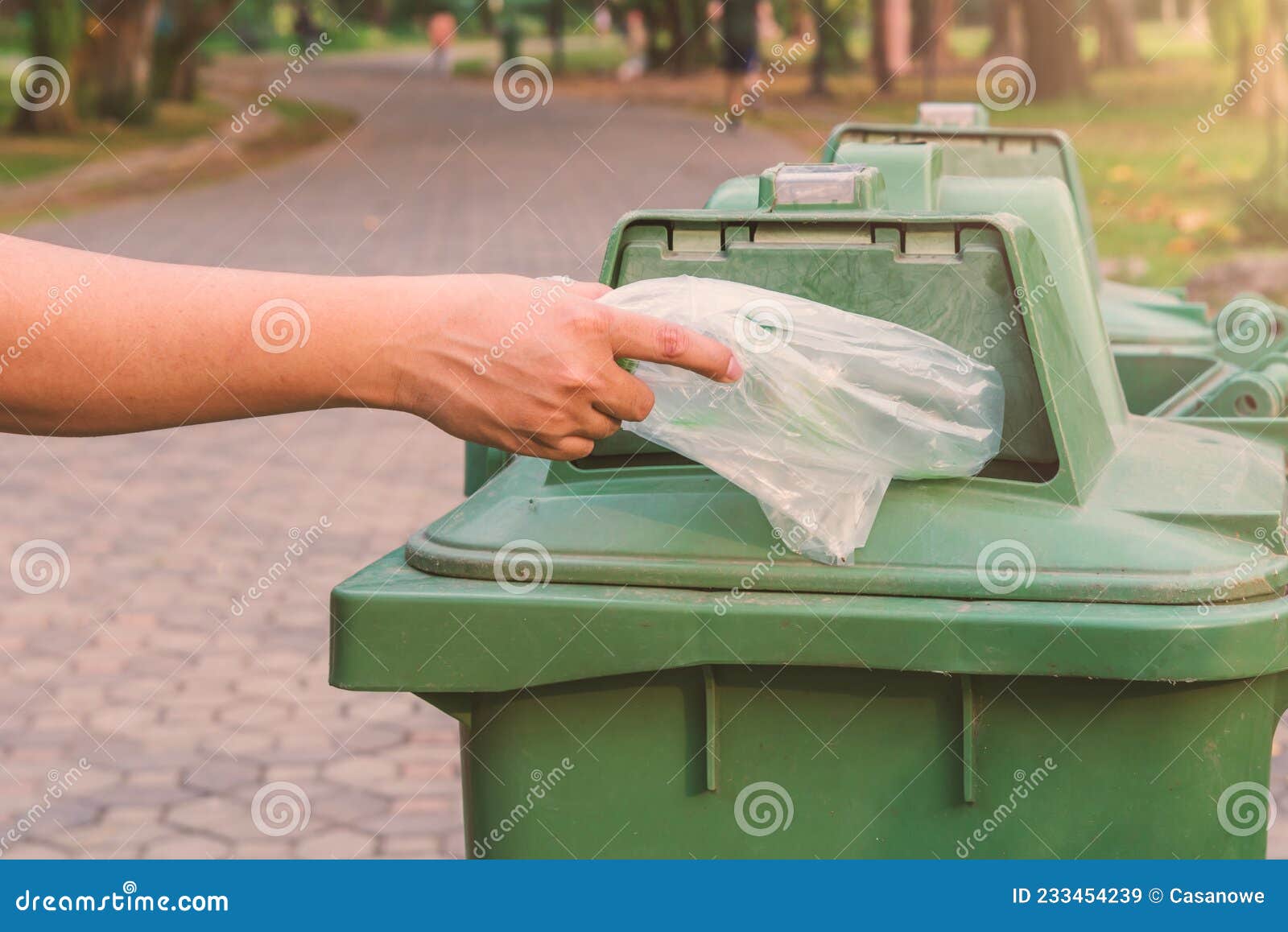 Hand Throwing Garbage or Plastic Bag Putting in Trash Cans Stock Image ...