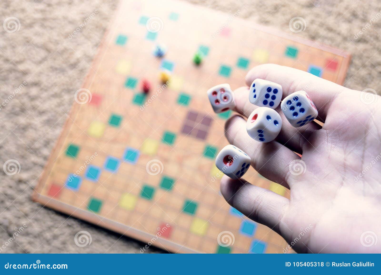 Hand Throwing White Dice Background Colorful Blurred Board Game. The ...