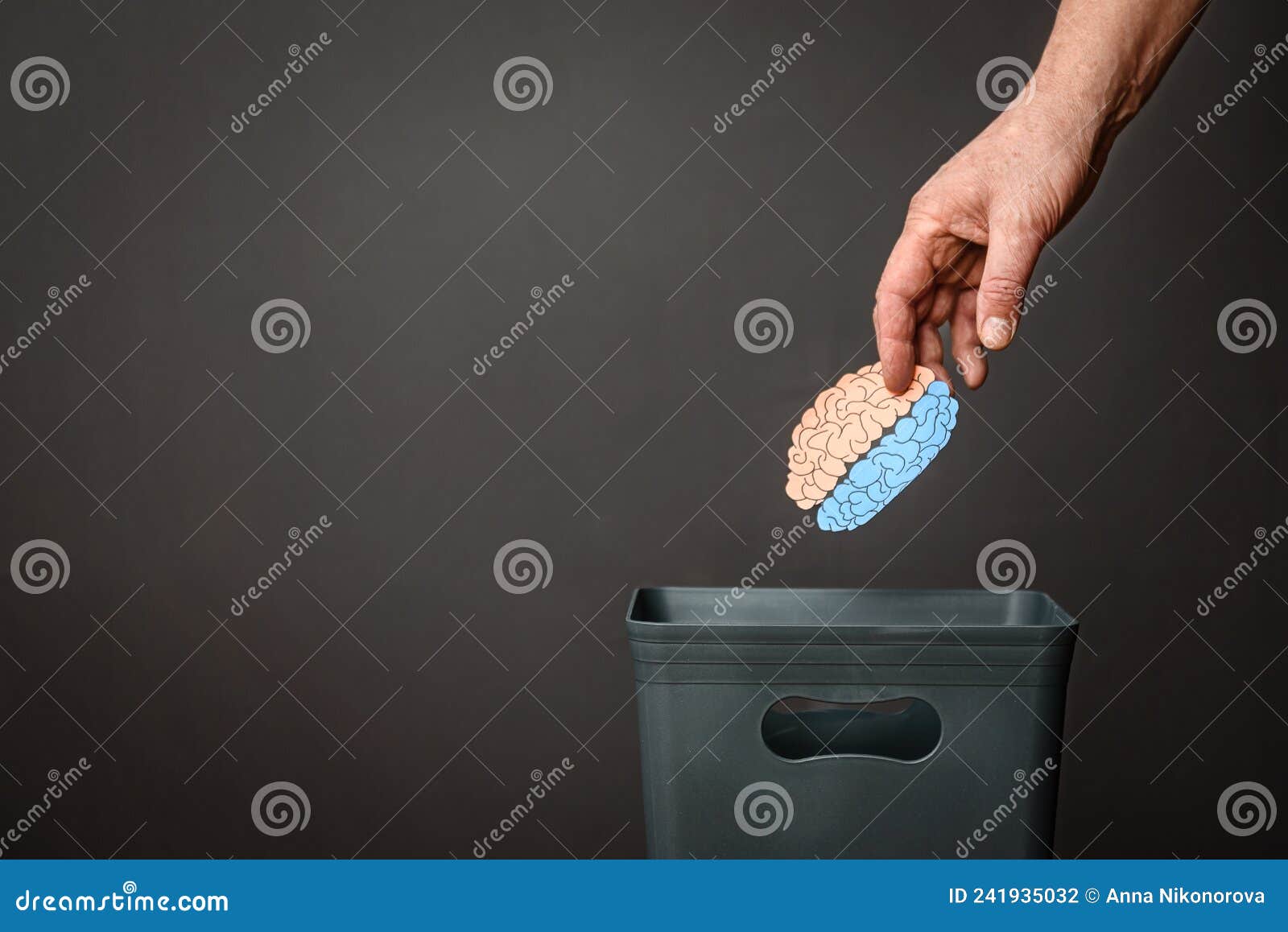 Hand Throws Away the Paper Brain is Thrown into the Trash Stock Photo ...