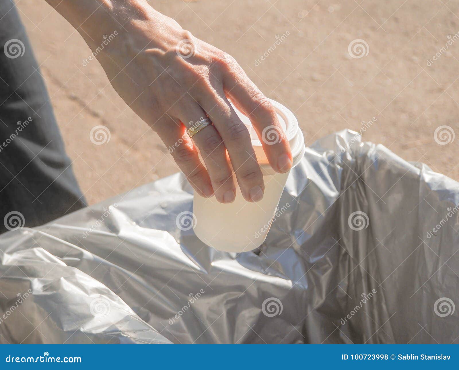 The Hand Throws the Plastic Cup in the Trash. Stock Photo - Image of ...