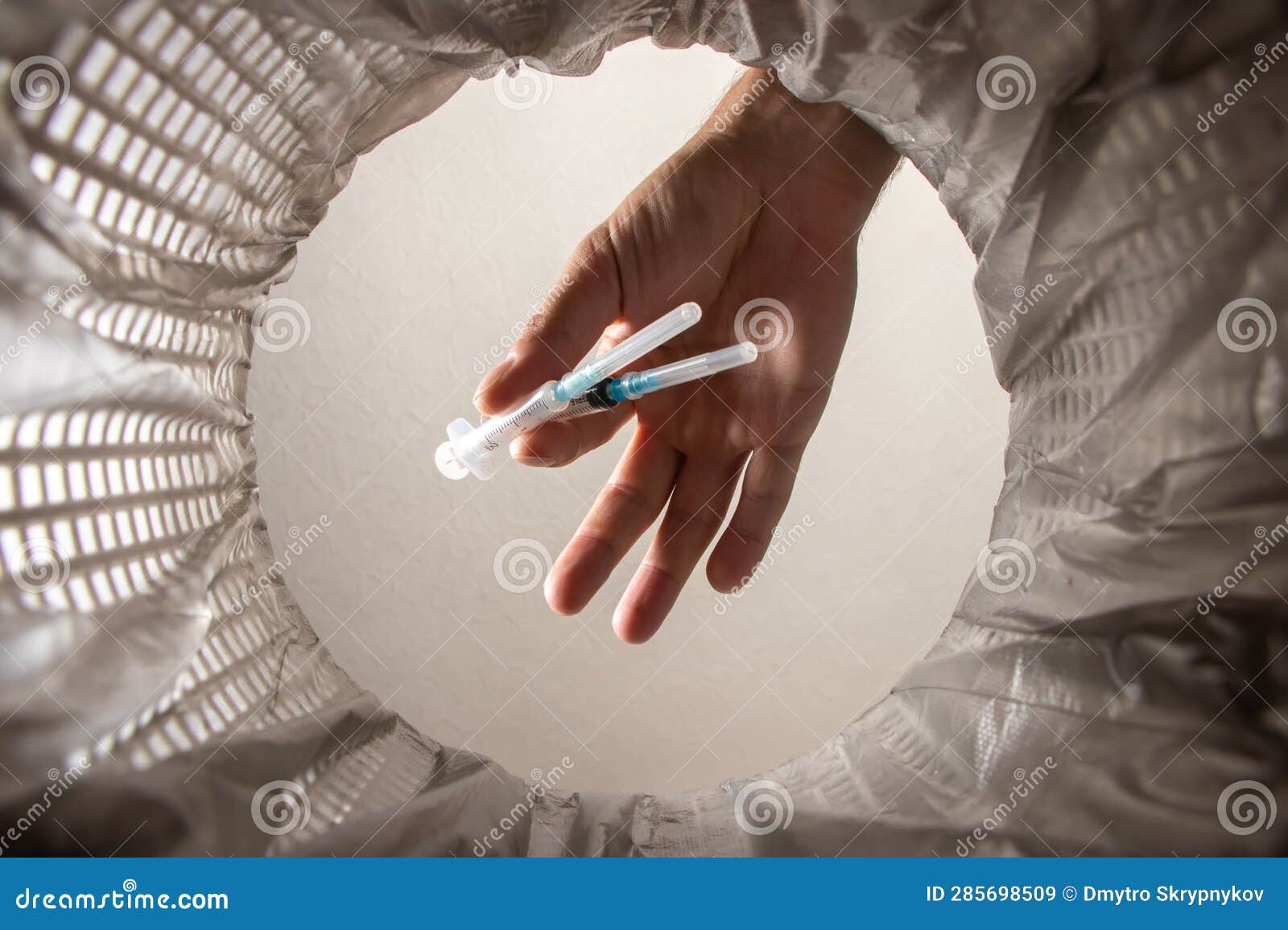 Hand Throws Syringe into Trash Bin with Package. Inside View Stock ...