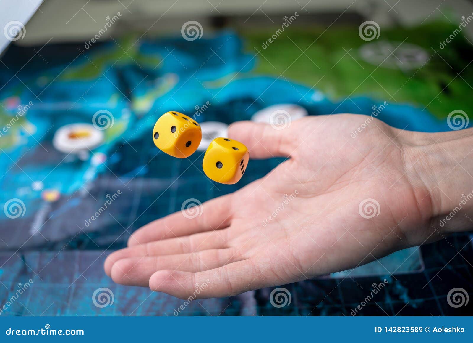 The Hand Throws Yellow Dice on the Playing Field. Luck and Excitement ...