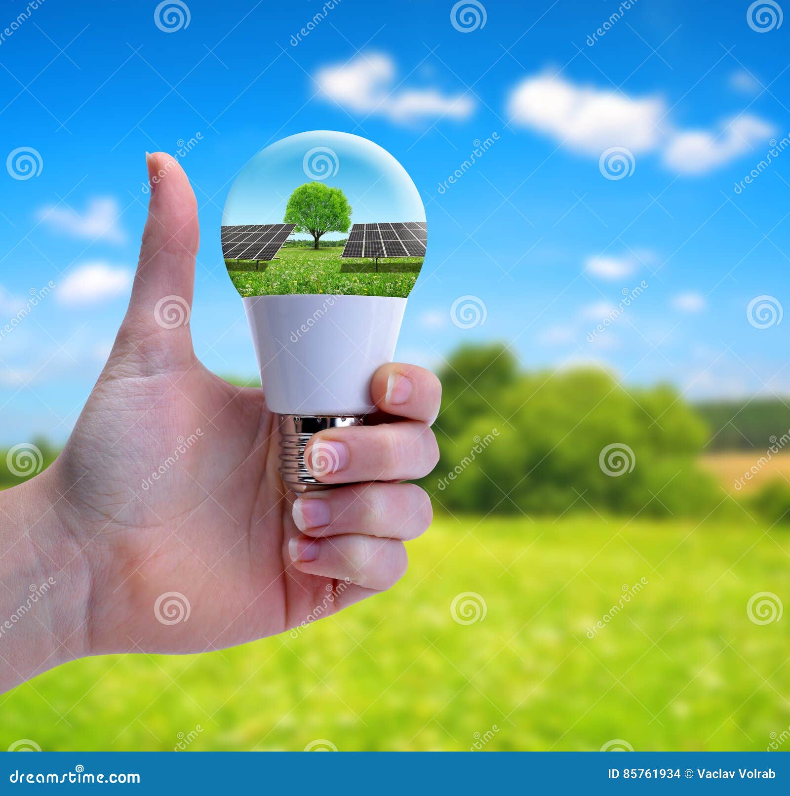 Hand with Thumb Up Holding a Eco LED Bulb with Solar Panel. Stock Photo ...