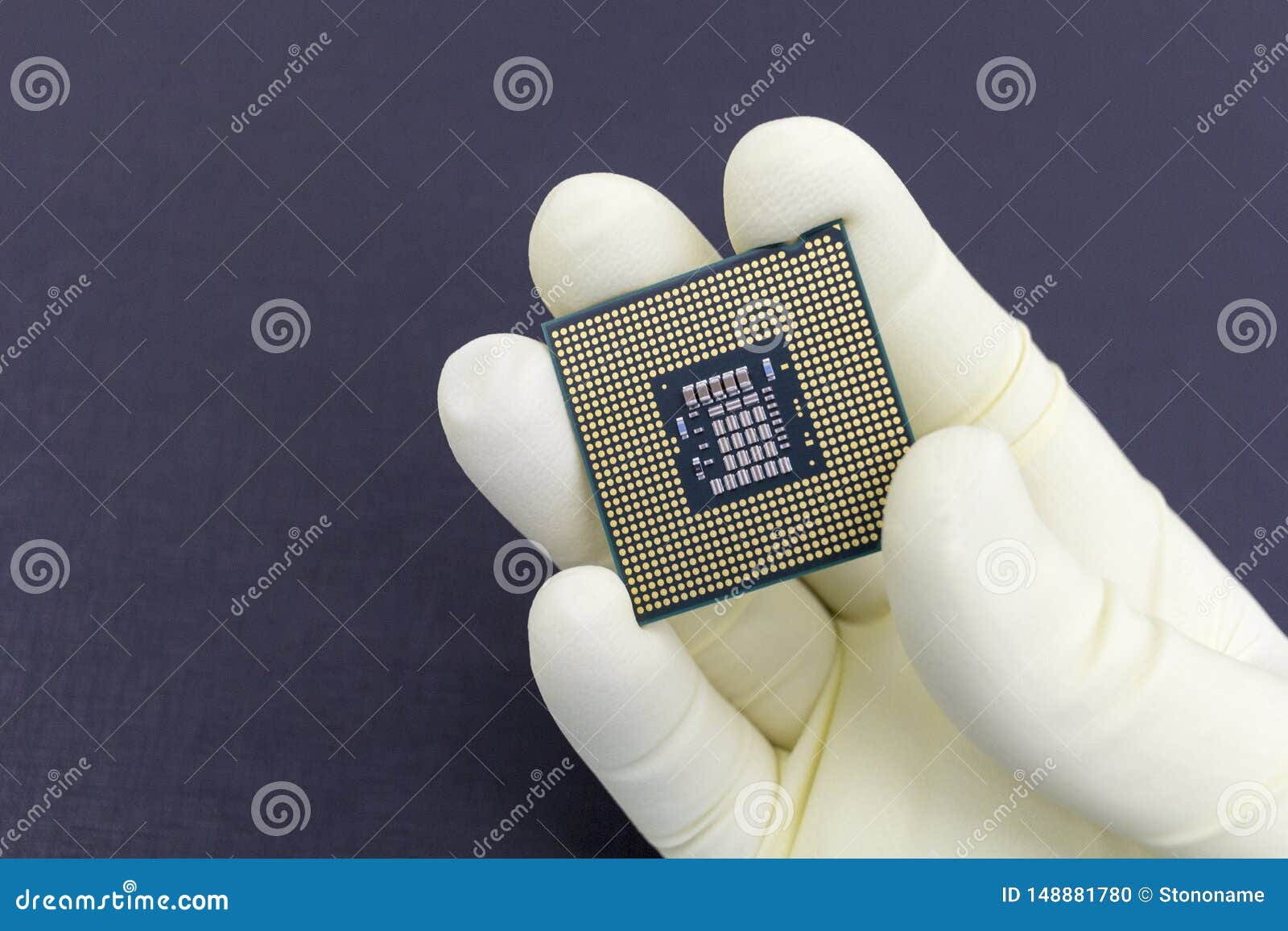 Hand in Tight Yellow Glove Holding a CPU Computer Processor Microchip ...