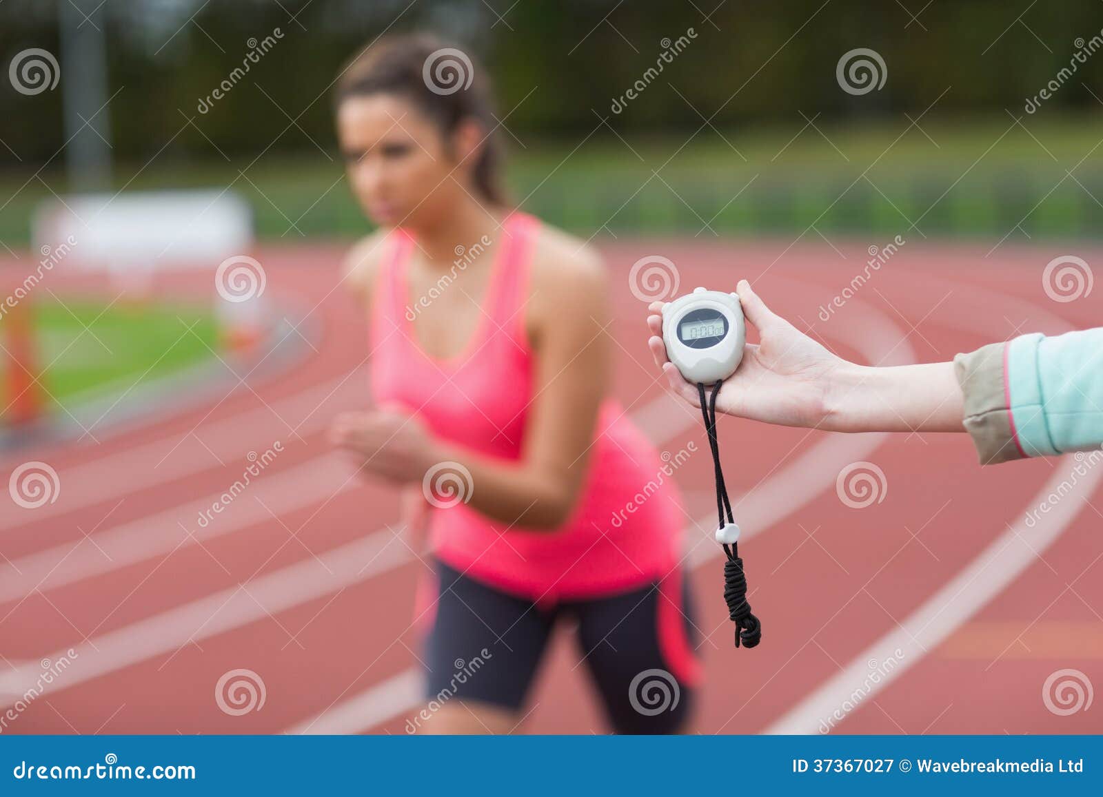 Hand Timing a Womans Run on the Running Track Stock Image - Image of ...