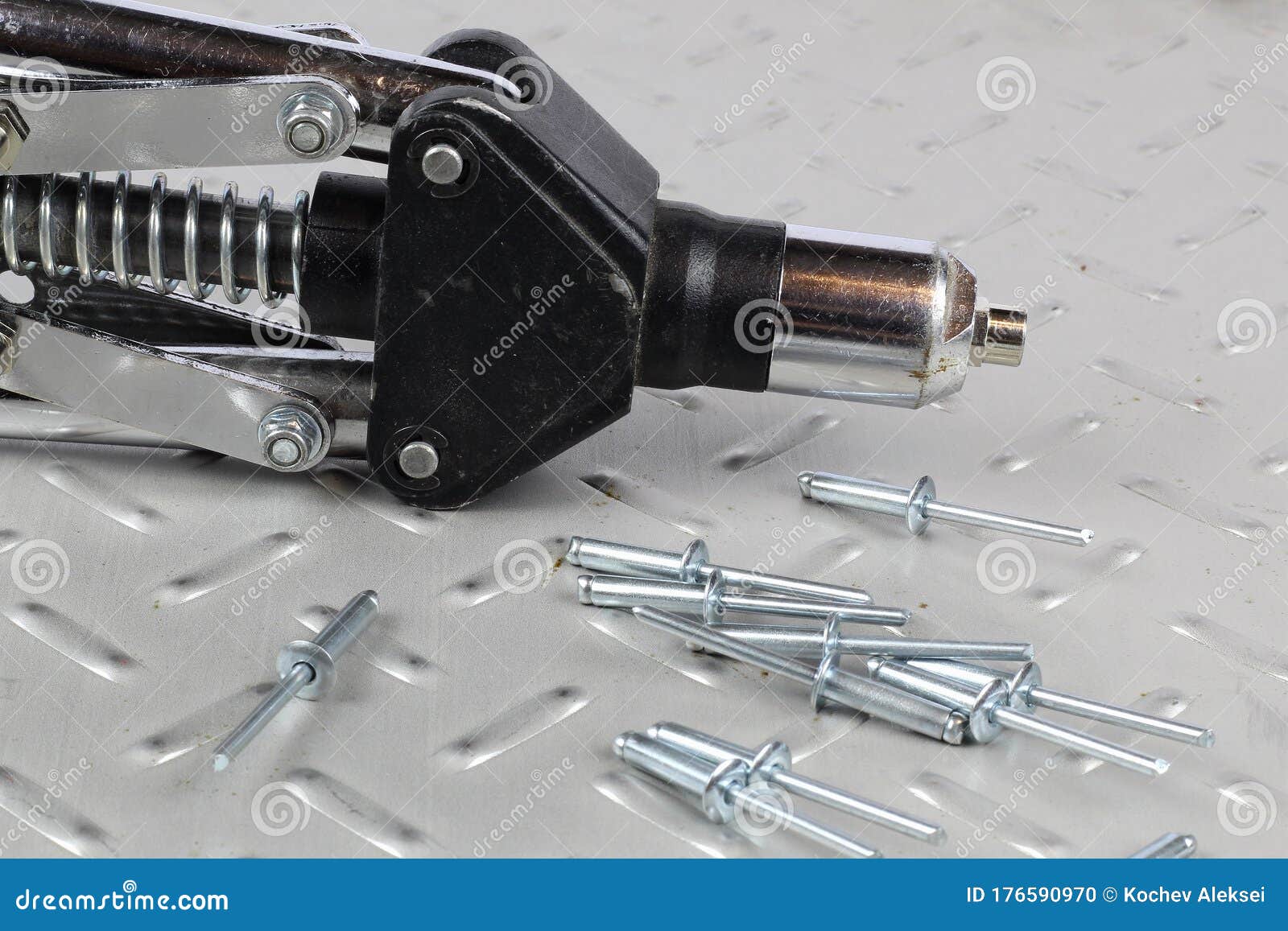 Hand Tools. Riveter for Mounting Blind Rivets on a Steel Background ...