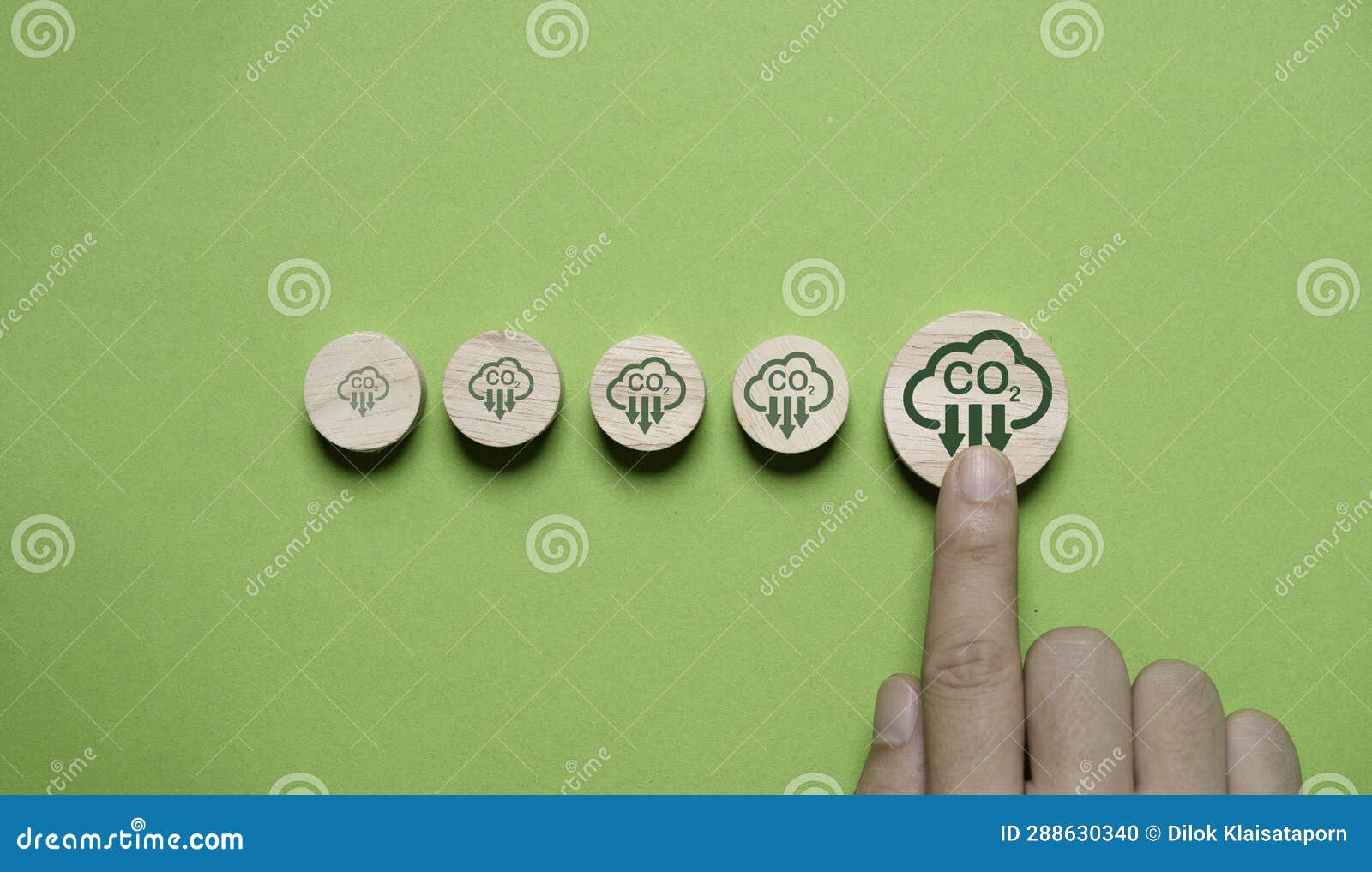 Hand Touching Bigger of CO2 Reducing Icon for Decrease CO2 Emission, Carbon Footprint and Carbon ...