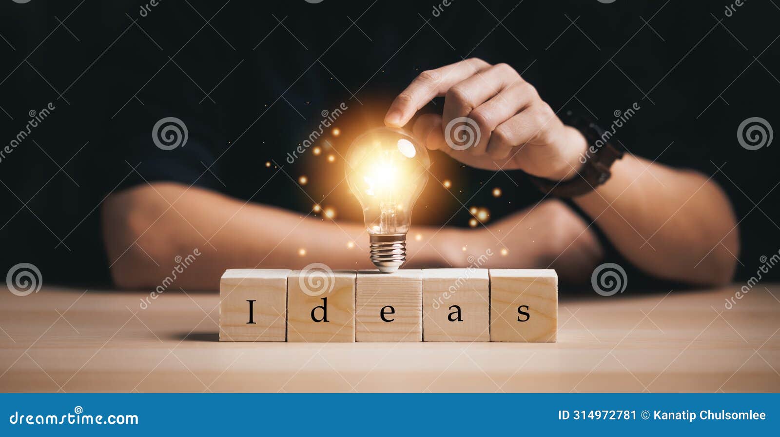 Hand Touching on Light Bulb on Wood Block with Word Ideas, Innovative ...