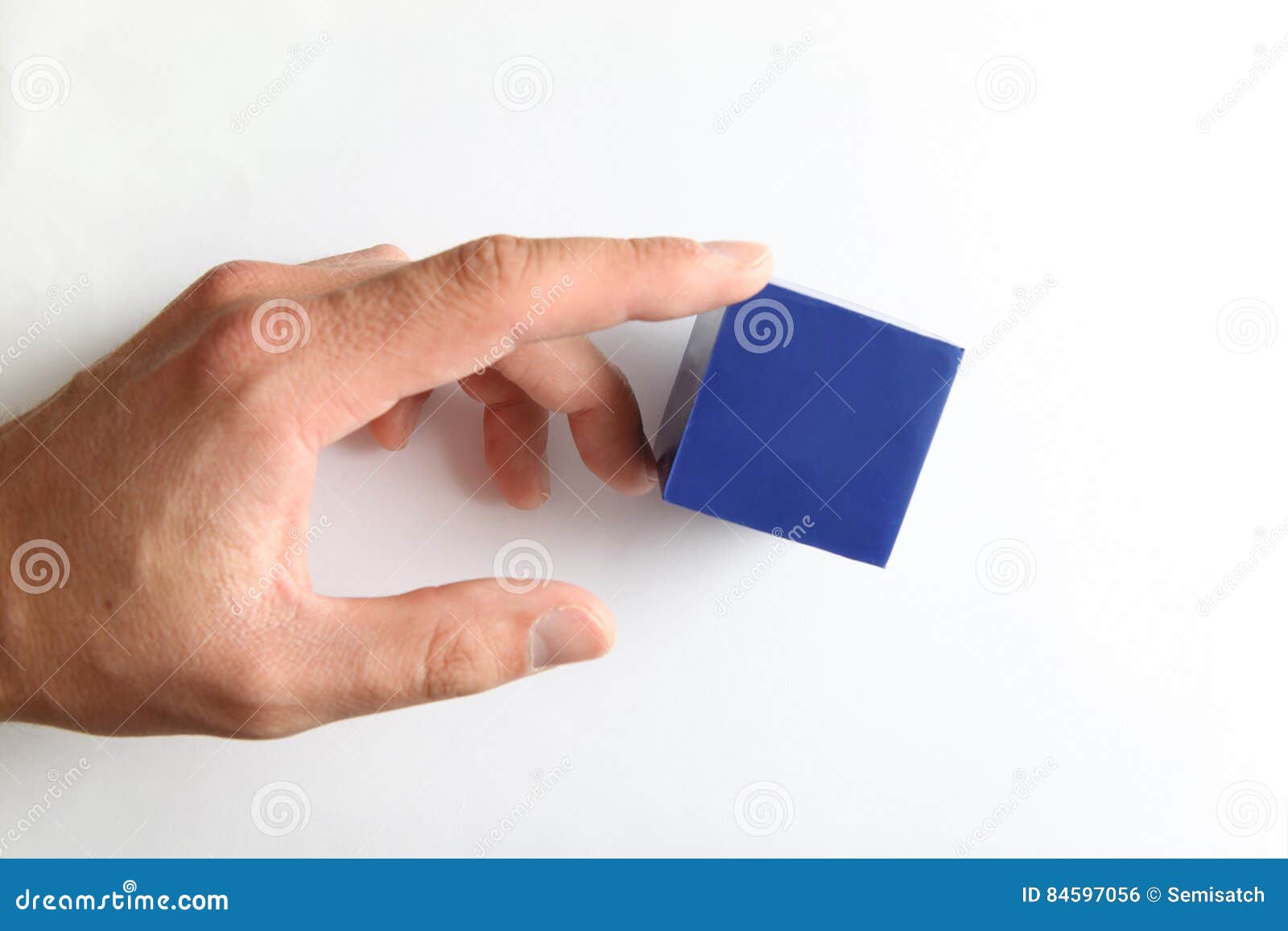 Hand Touching Small Blue Cube Stock Photo - Image of piece, concept ...