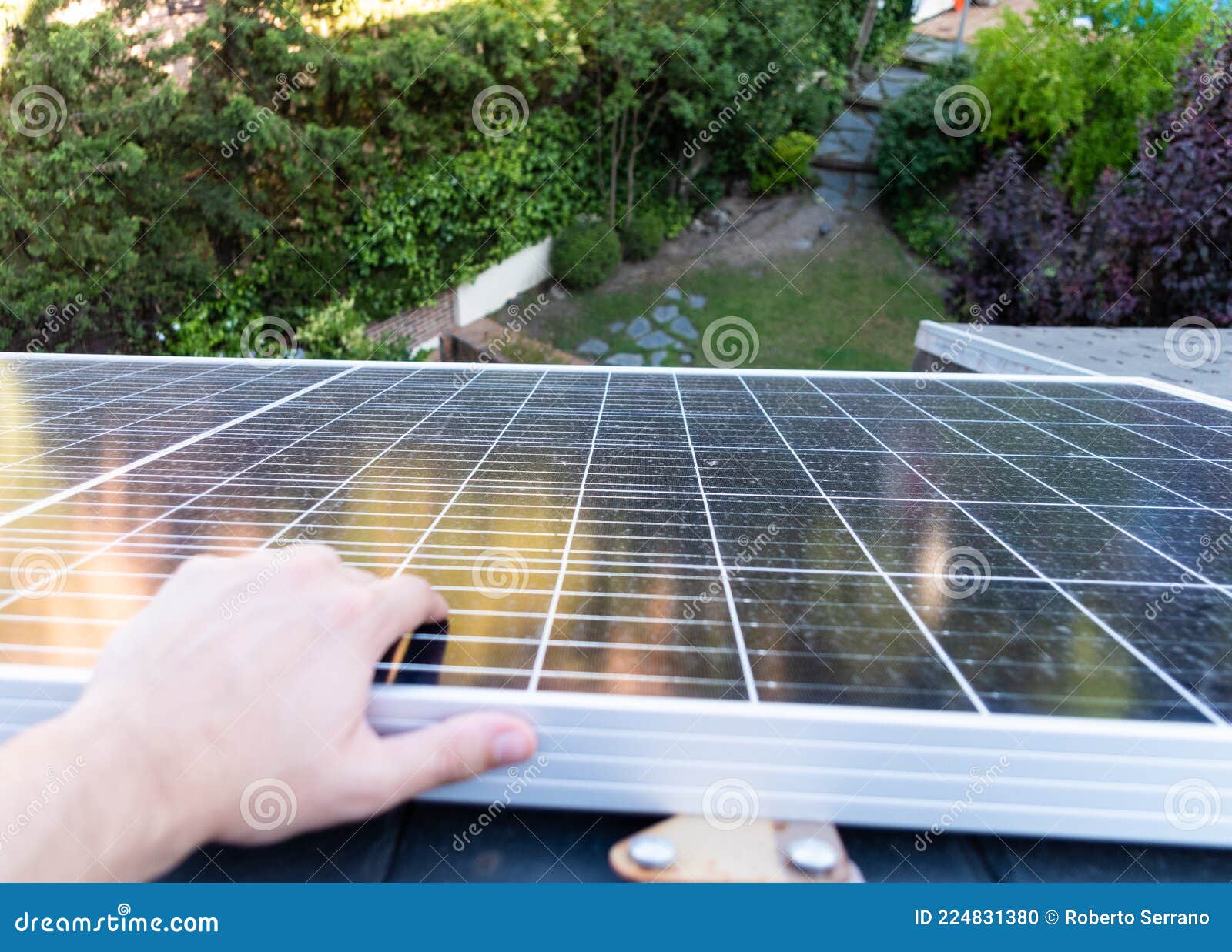 Hand Touching a Solar Panel Stock Photo - Image of mobile, nature ...