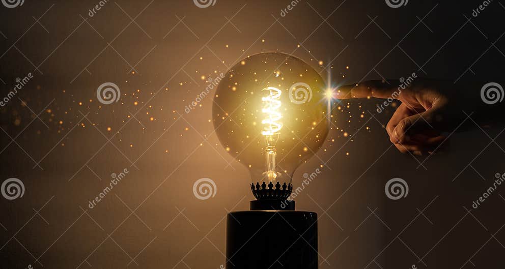Hand Touching To Glowing Lamp or Lightbulb for Creative Thinking Idea and Problem Solving or ...