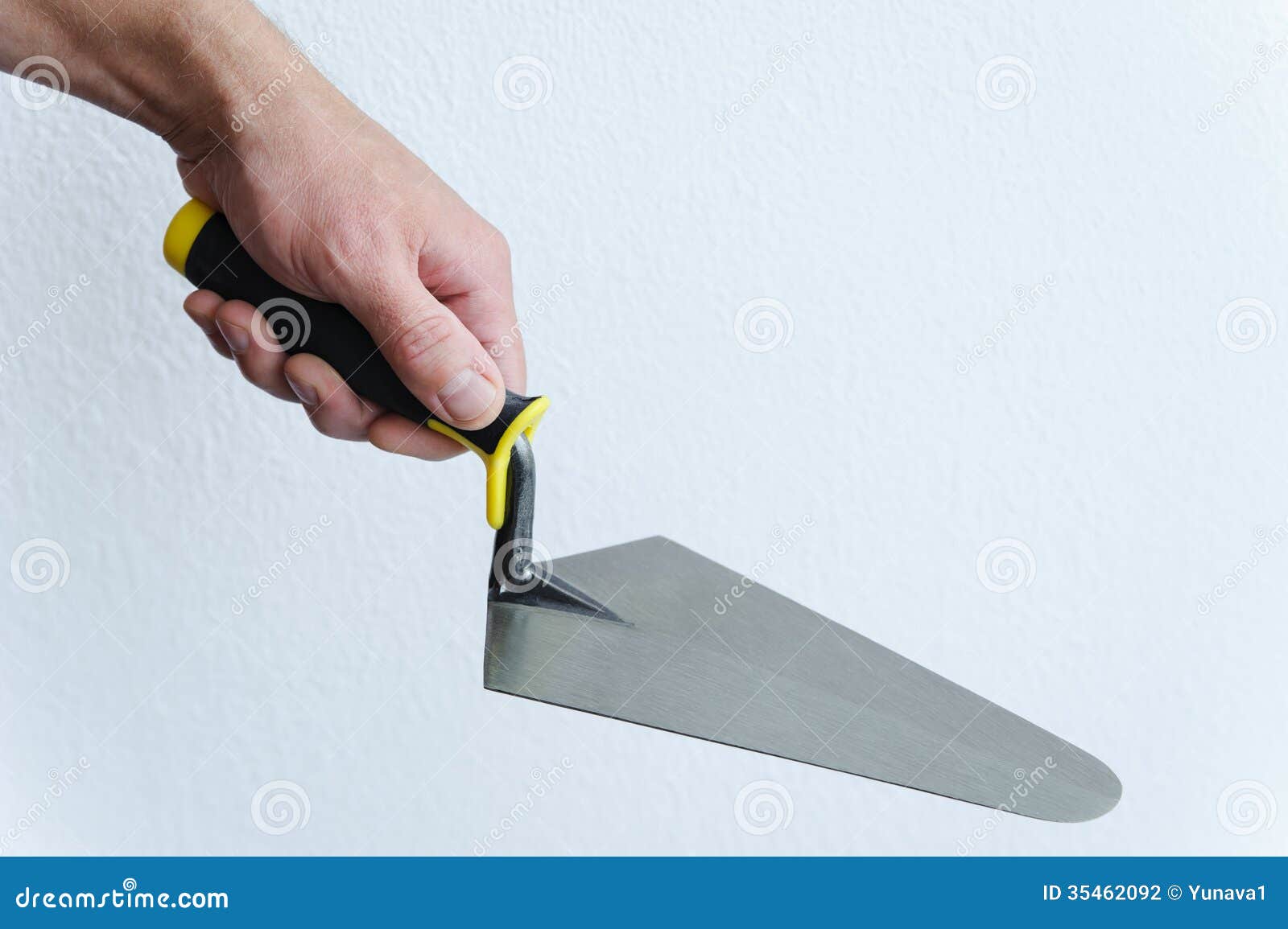 Hand with trowel stock photo. Image of buildings, trowel - 35462092