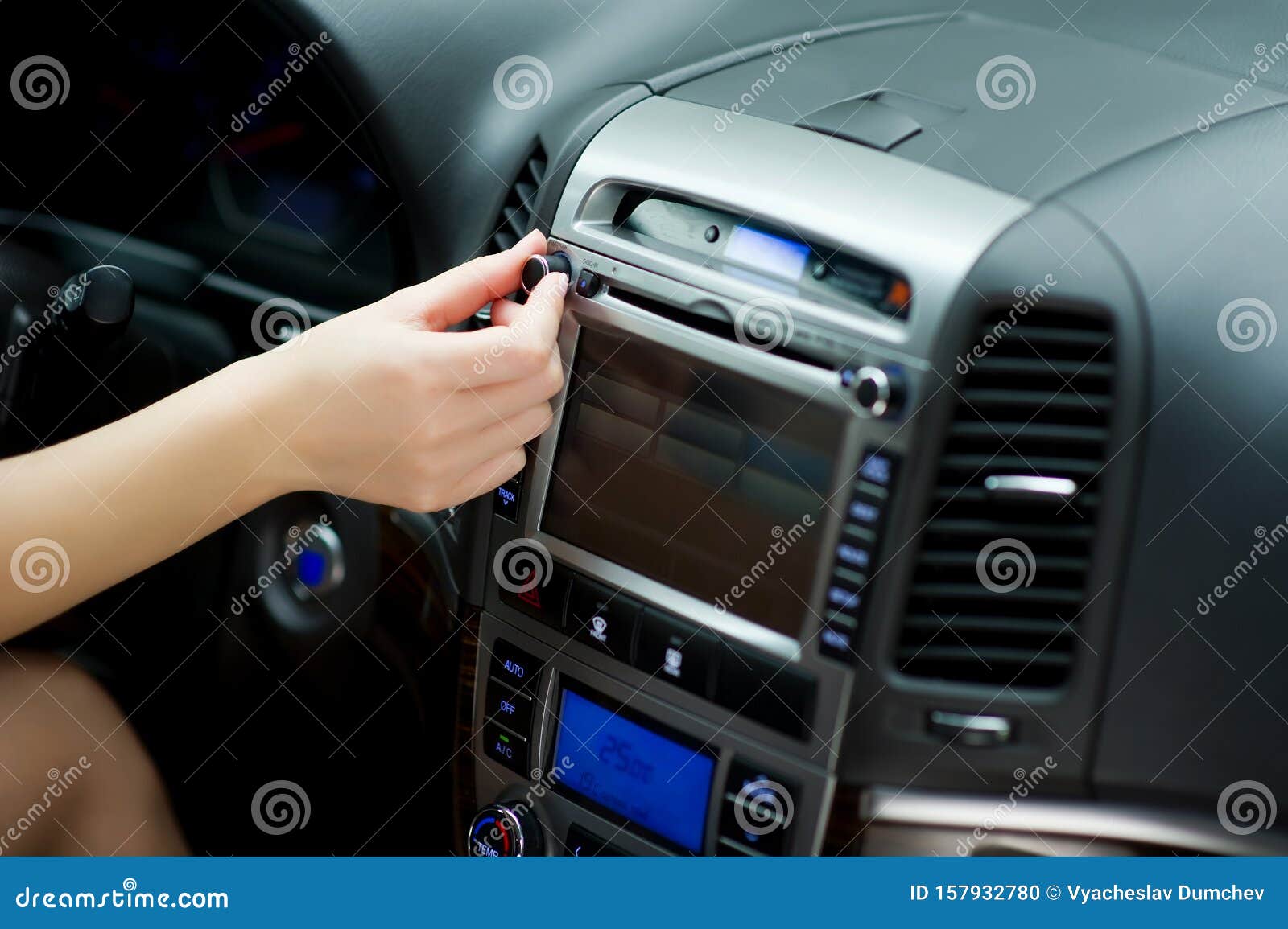 Hand Tunes in Radio Stations and Adjusting Sound Volume on the Car ...