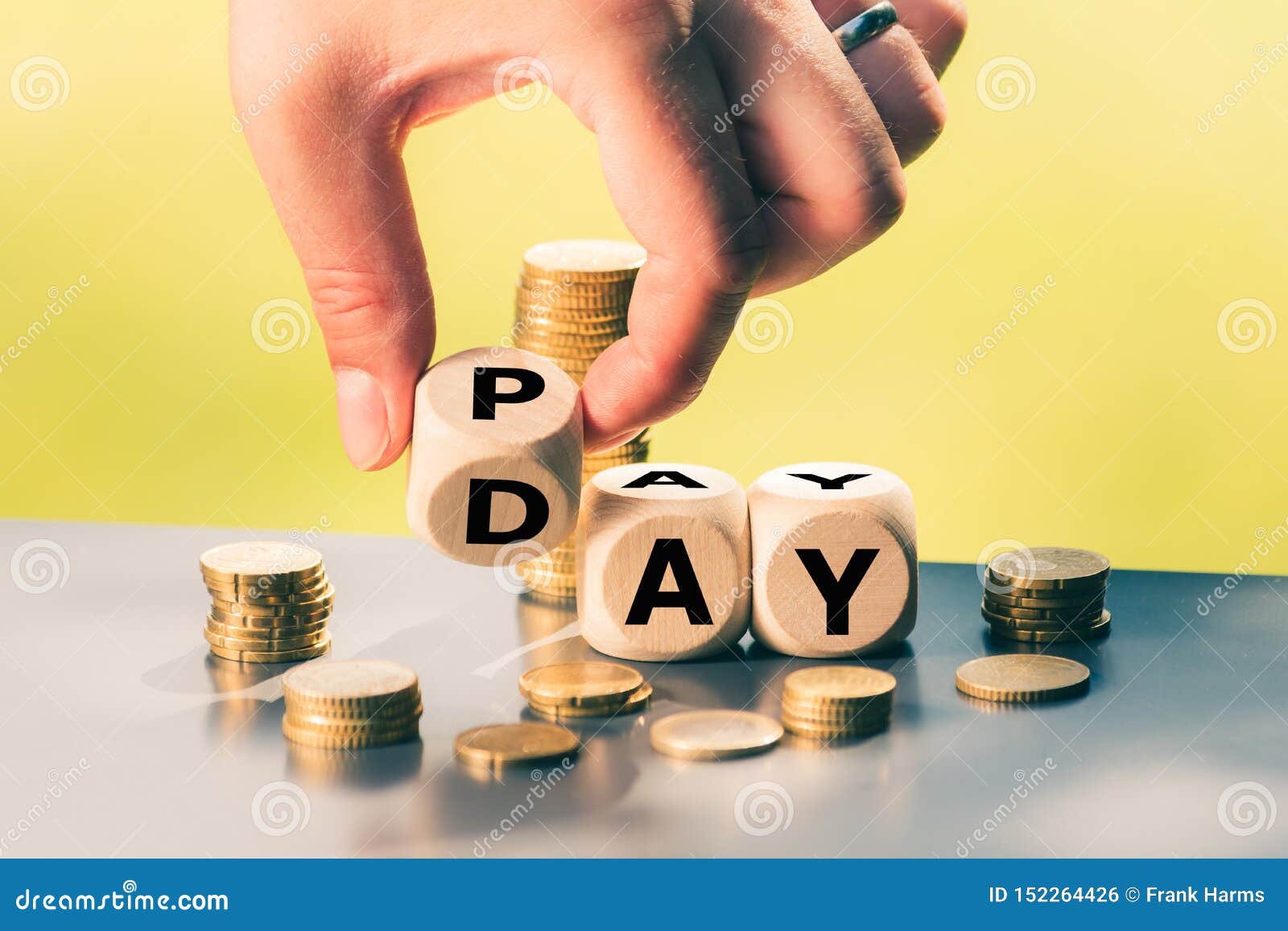 Hand is Turning a Dice and Changes the Word Pay To Day Stock Photo ...
