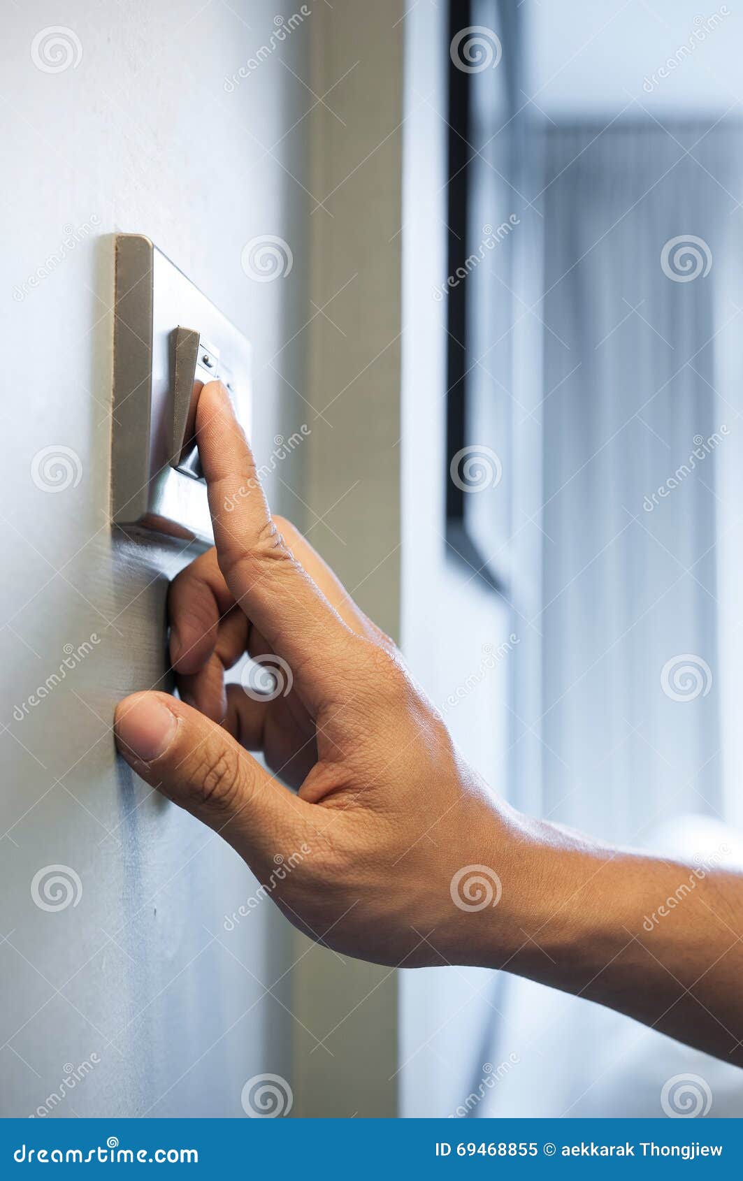 Hand is Turning on a Light Switch at the Livingroom in a House. Stock ...