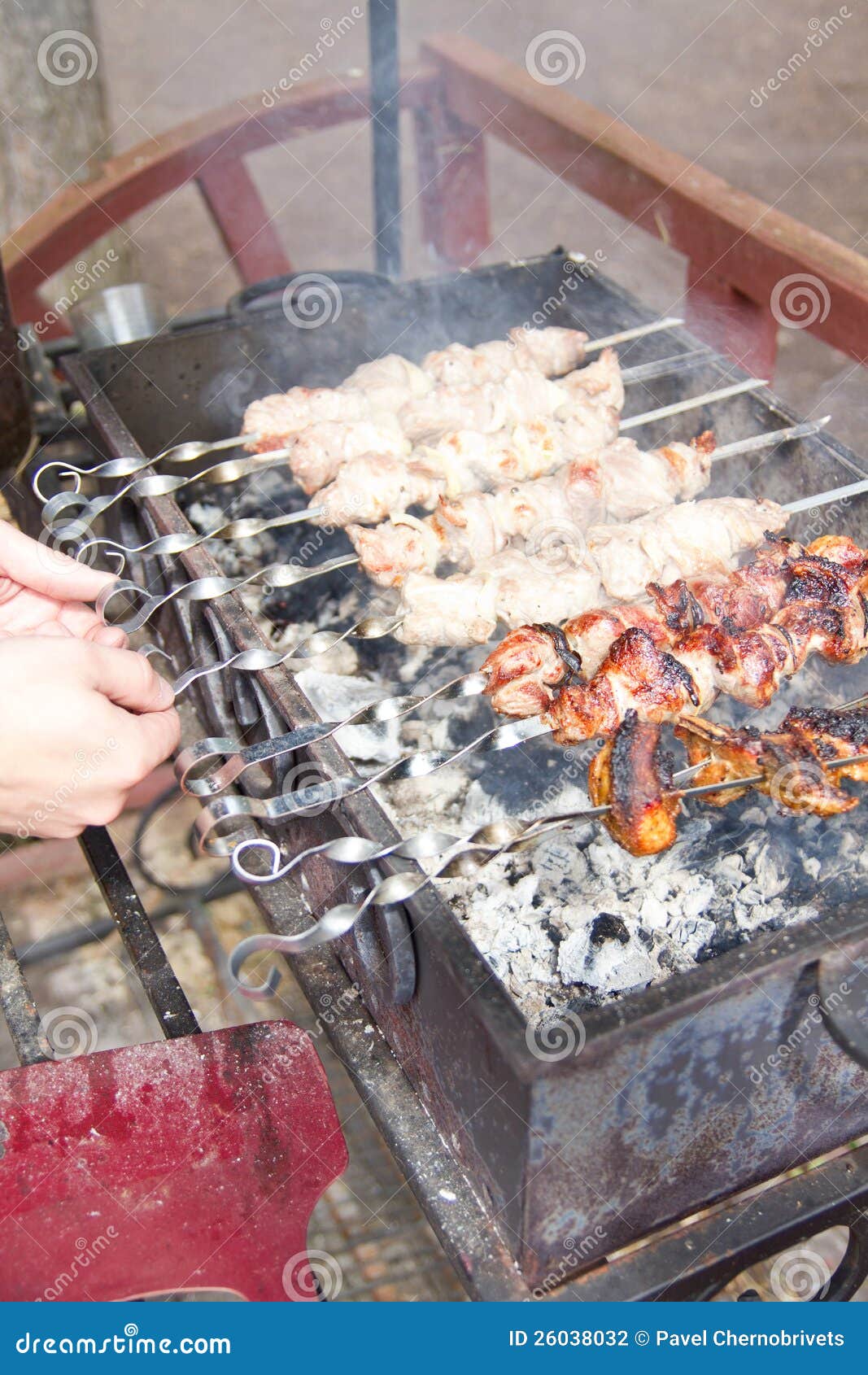 Hand turning skewer stock photo. Image of food, burning - 26038032