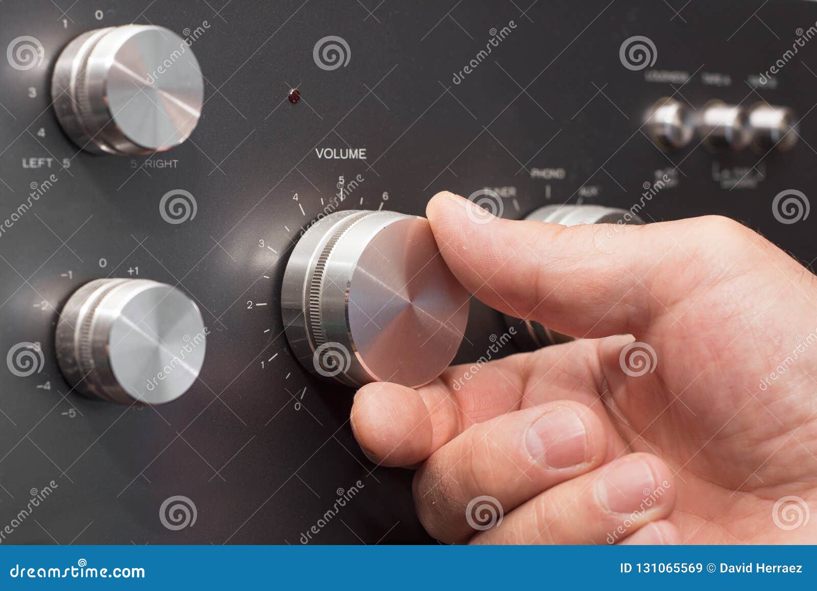 Hand Turning Up the Volume in a Stereo Stock Image - Image of loud ...