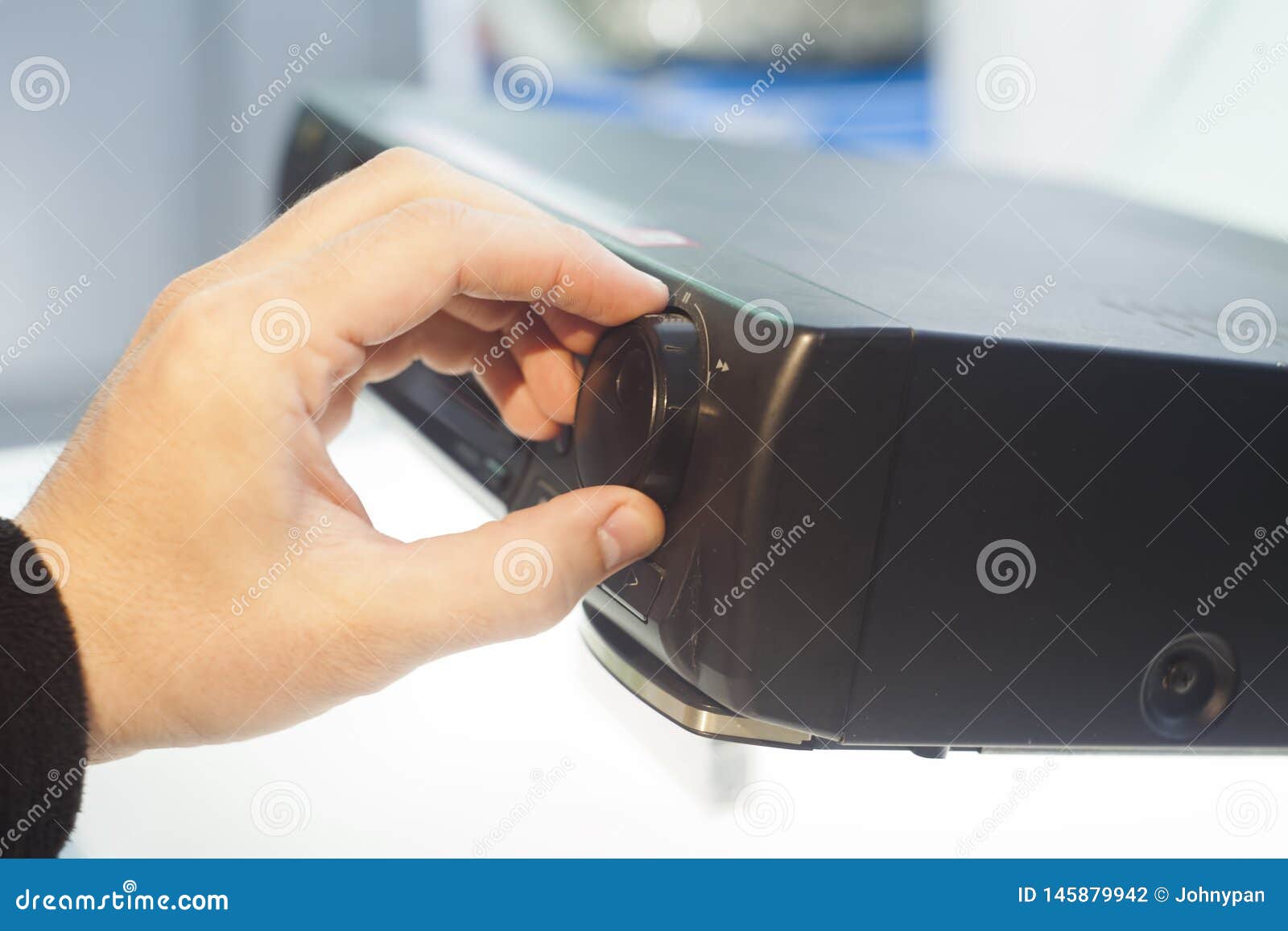 Hand turning volume knob stock photo. Image of frequency - 145879942