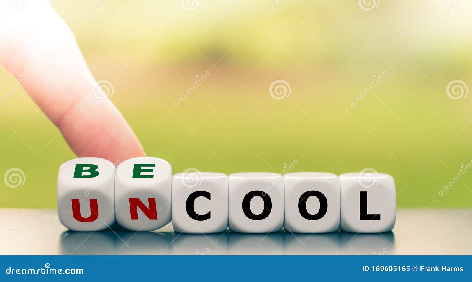 Hand Turns a Dice and Changes the Expression `uncool` To `be Cool ...