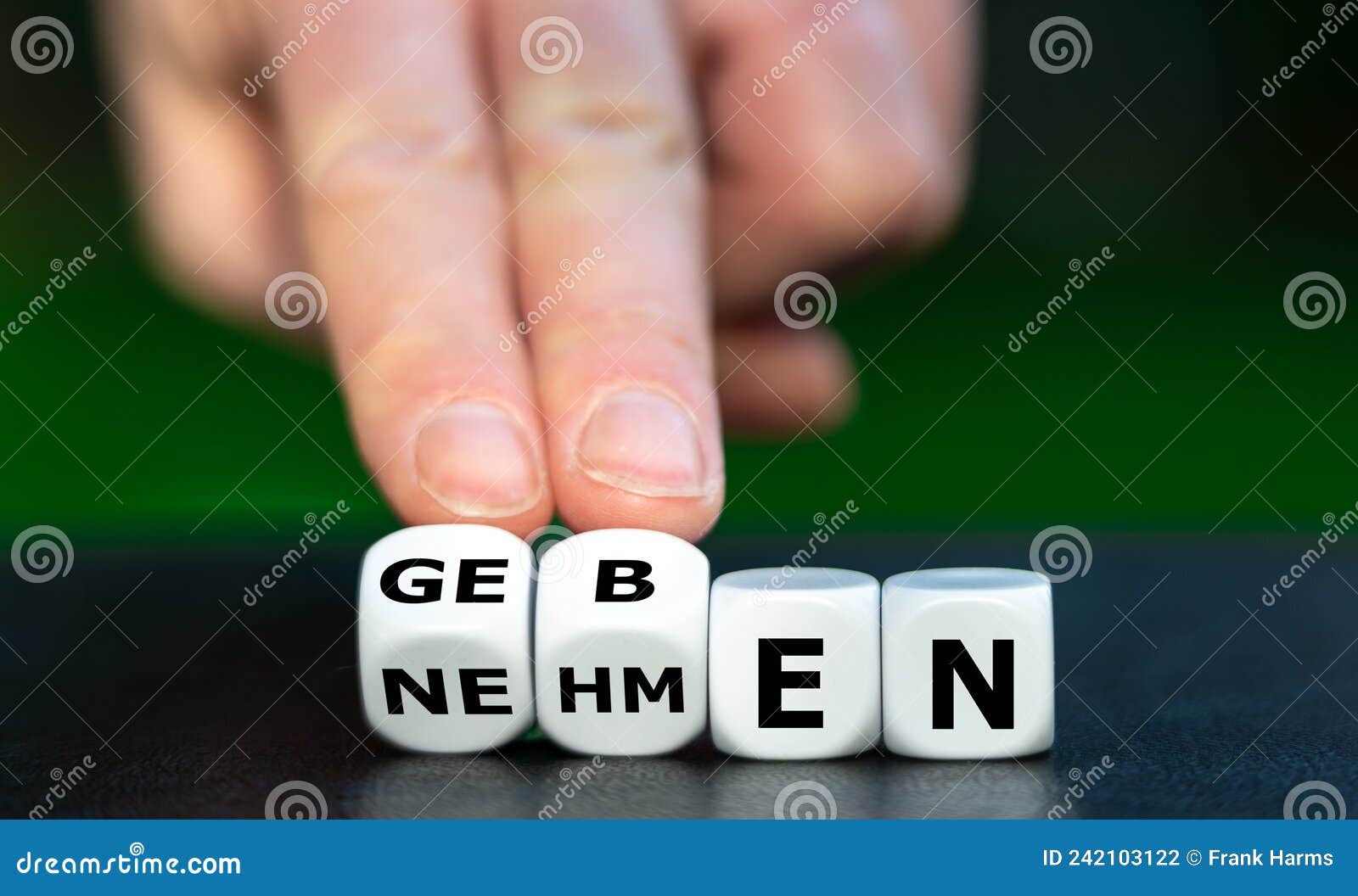 Hand Turns Dice and Changes the German Word `nehmen` Take To `geben ...