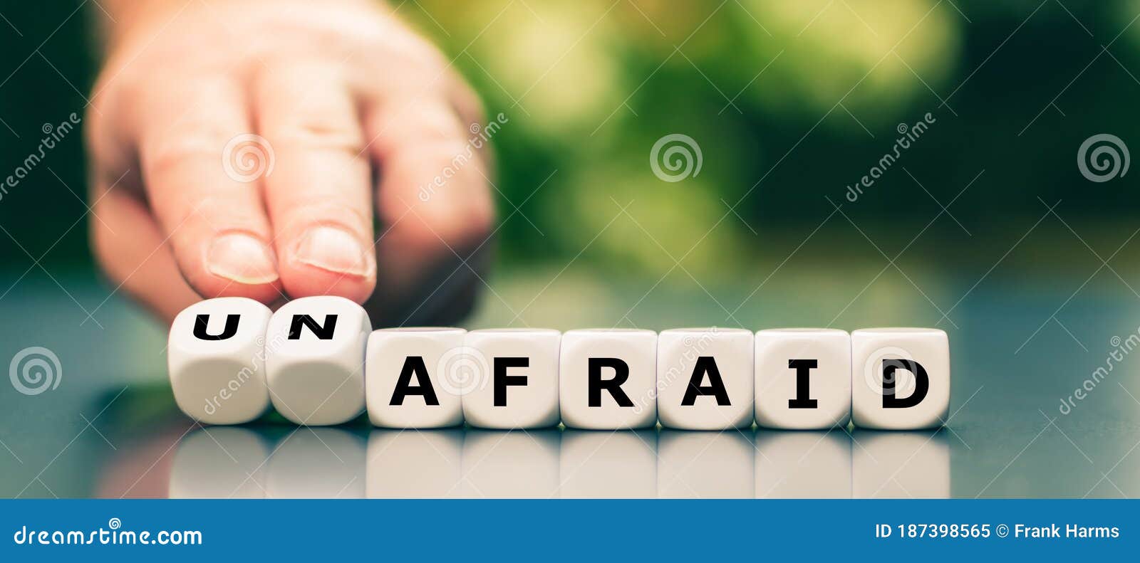 Hand Turns Dice and Changes the Word `afraid` To `unafraid`. Stock ...