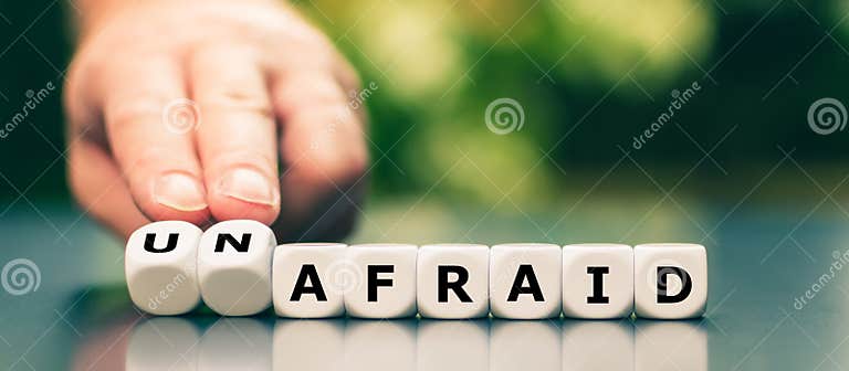 Hand Turns Dice and Changes the Word `afraid` To `unafraid`. Stock ...
