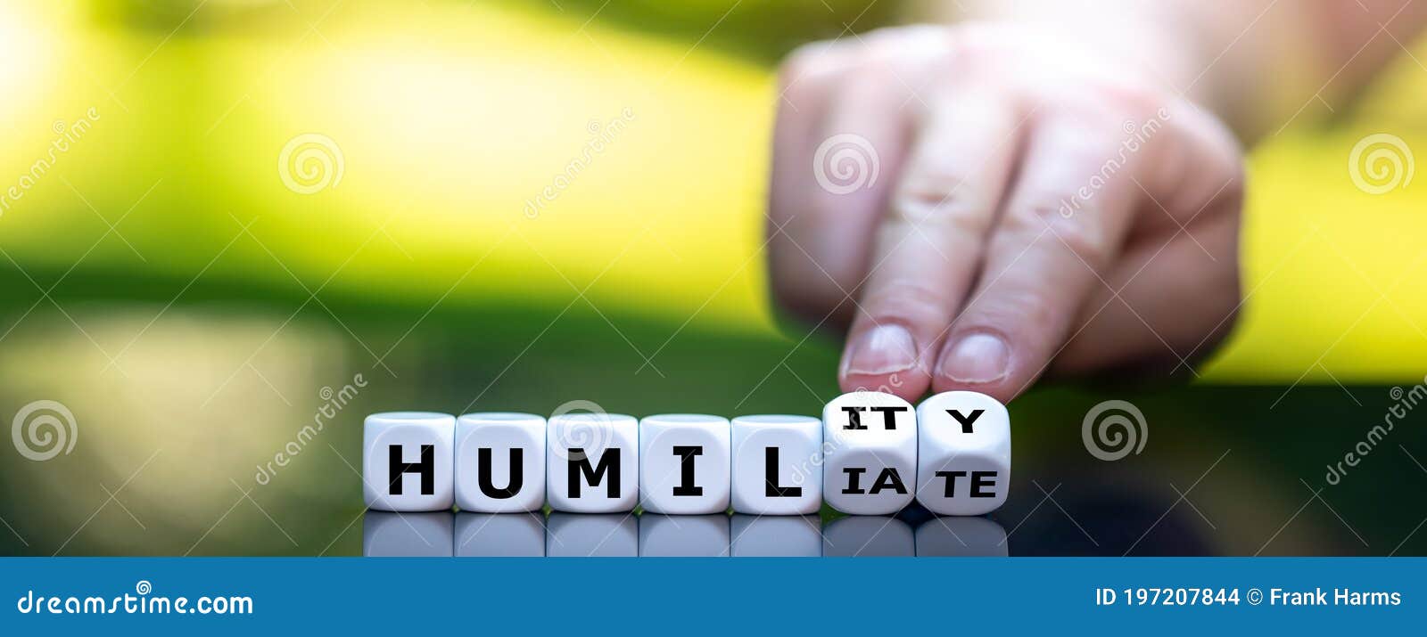 Hand Turns Dice and Changes the Word `humiliate` To `humility`. Stock ...