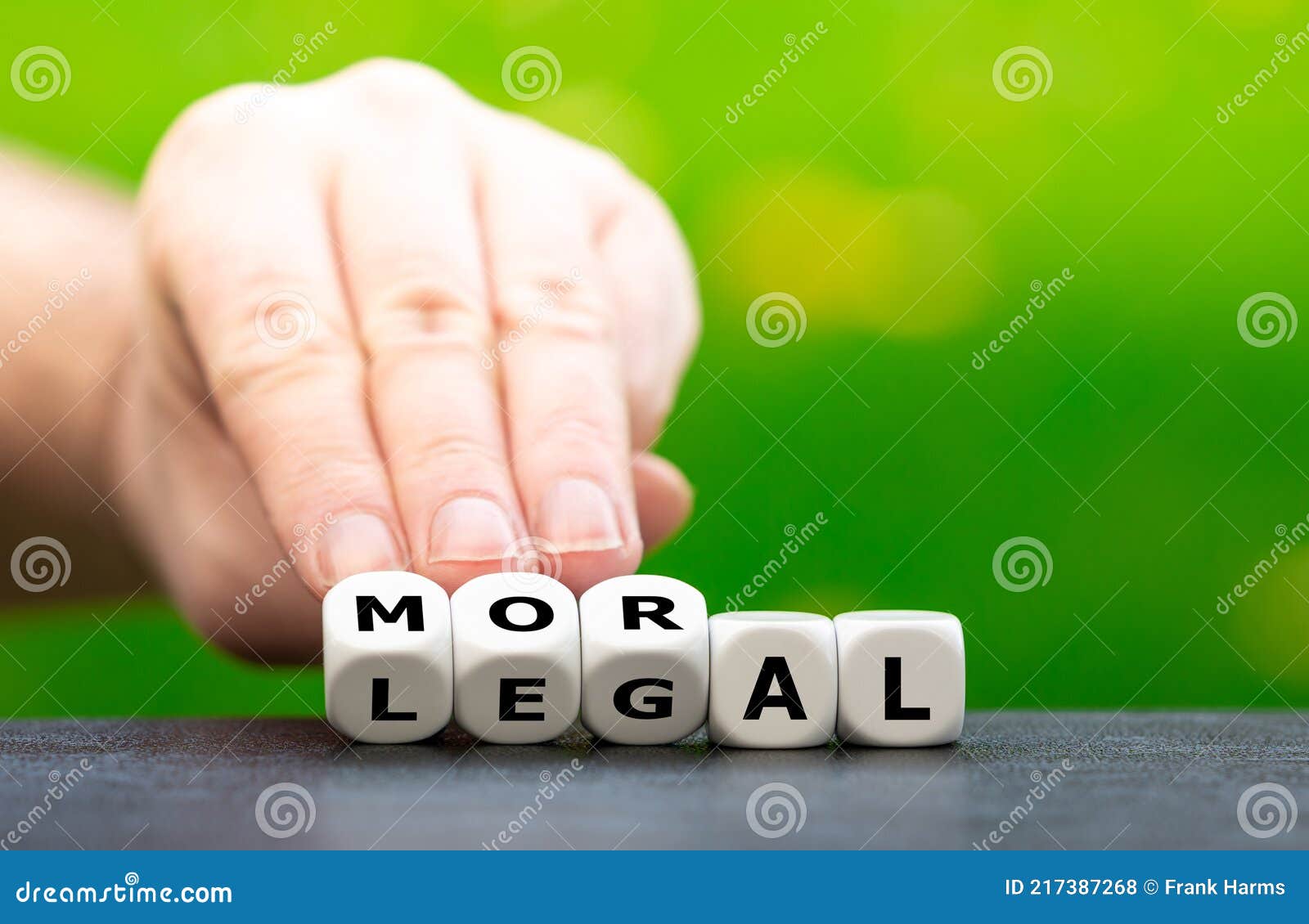 Hand Turns Dice and Changes the Word `legal` To `moral`. Stock Photo ...