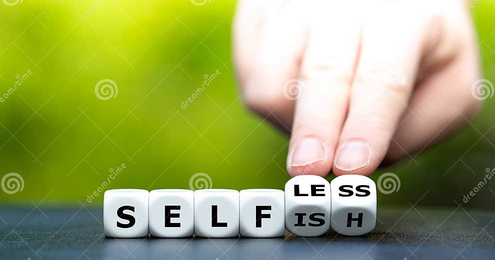 Hand Turns Dice and Changes the Word `selfish` To `selfless`. Stock ...
