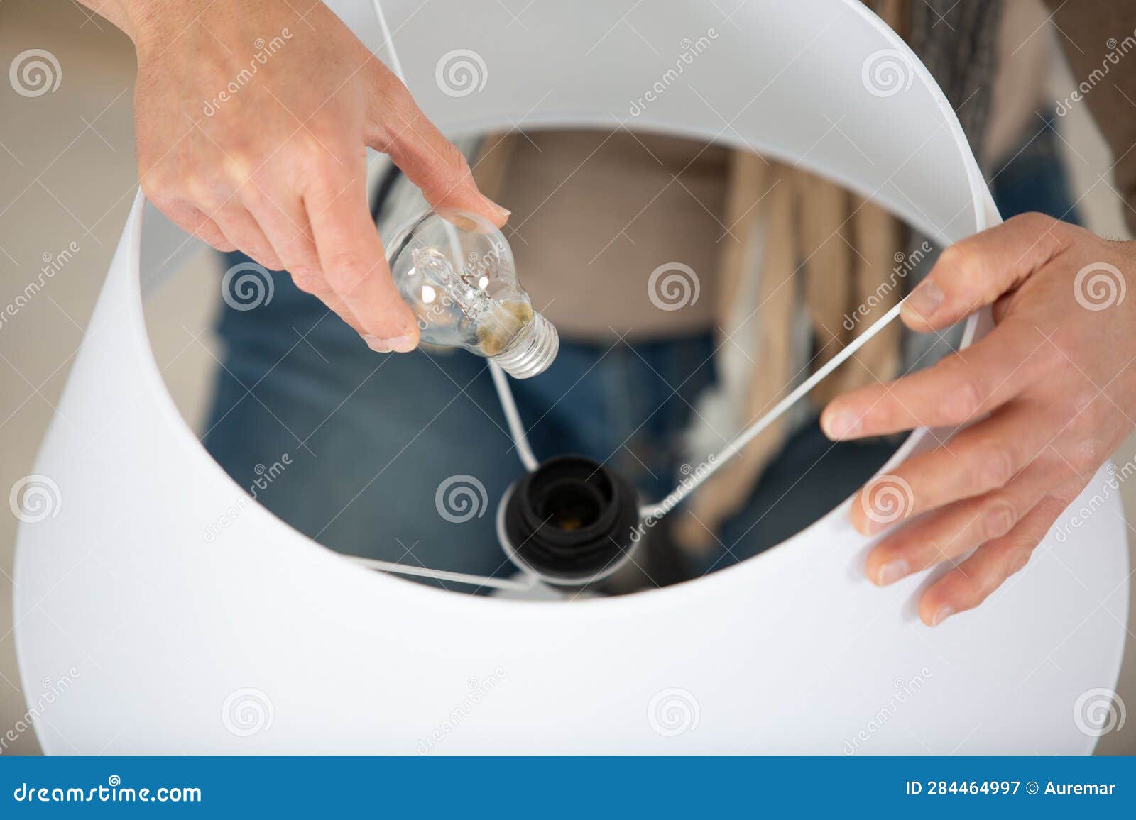 Hand turns switch on lamp stock image. Image of lights - 284464997