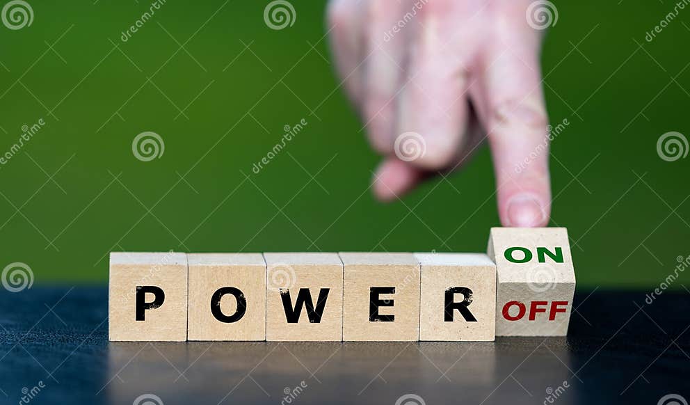 Hand Turns Wooden Cube and Changes the Expression Power Off To Power on ...