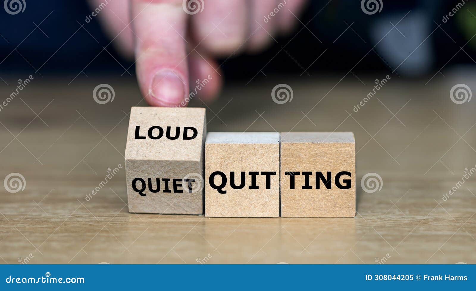 Hand Turns Wooden Cube and Changes the Expression Quiet Quitting To ...