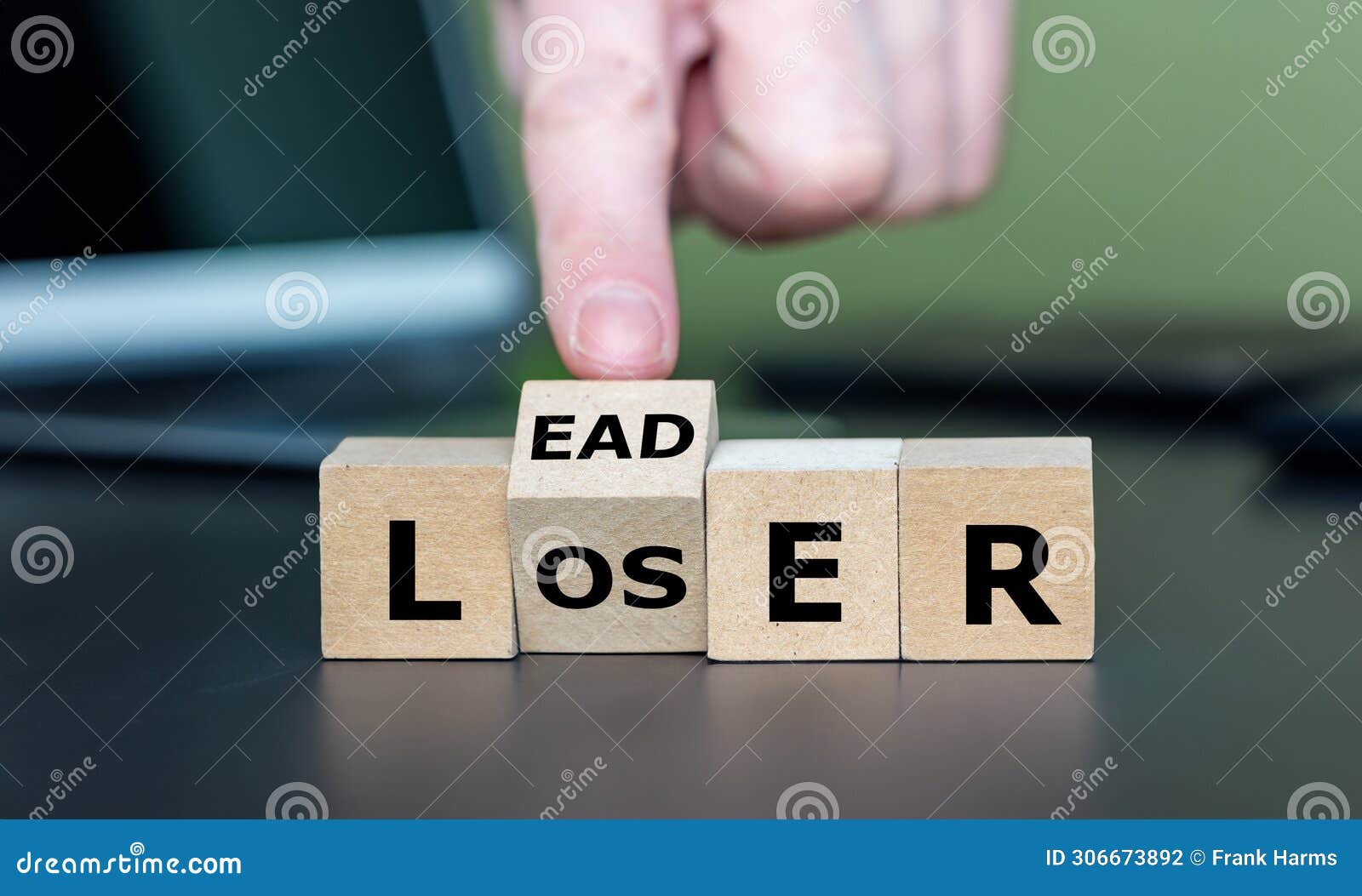 Hand Turns Wooden Cube and Changes the Word Loser To Leader. Stock ...