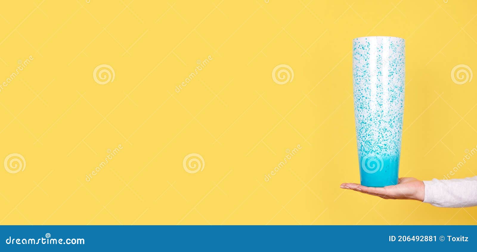 Hand with Turquoise Glass Vase on Yellow Background Stock Image - Image ...
