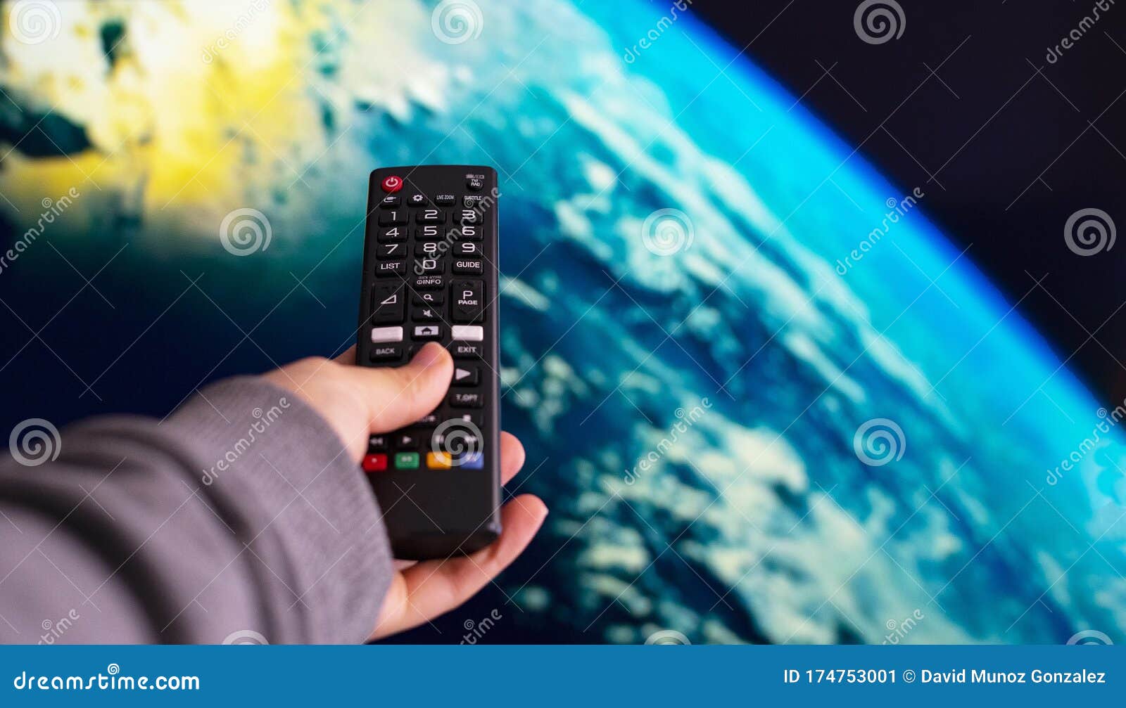 Hand with Tv Remote Control with the Space in the Background Stock ...