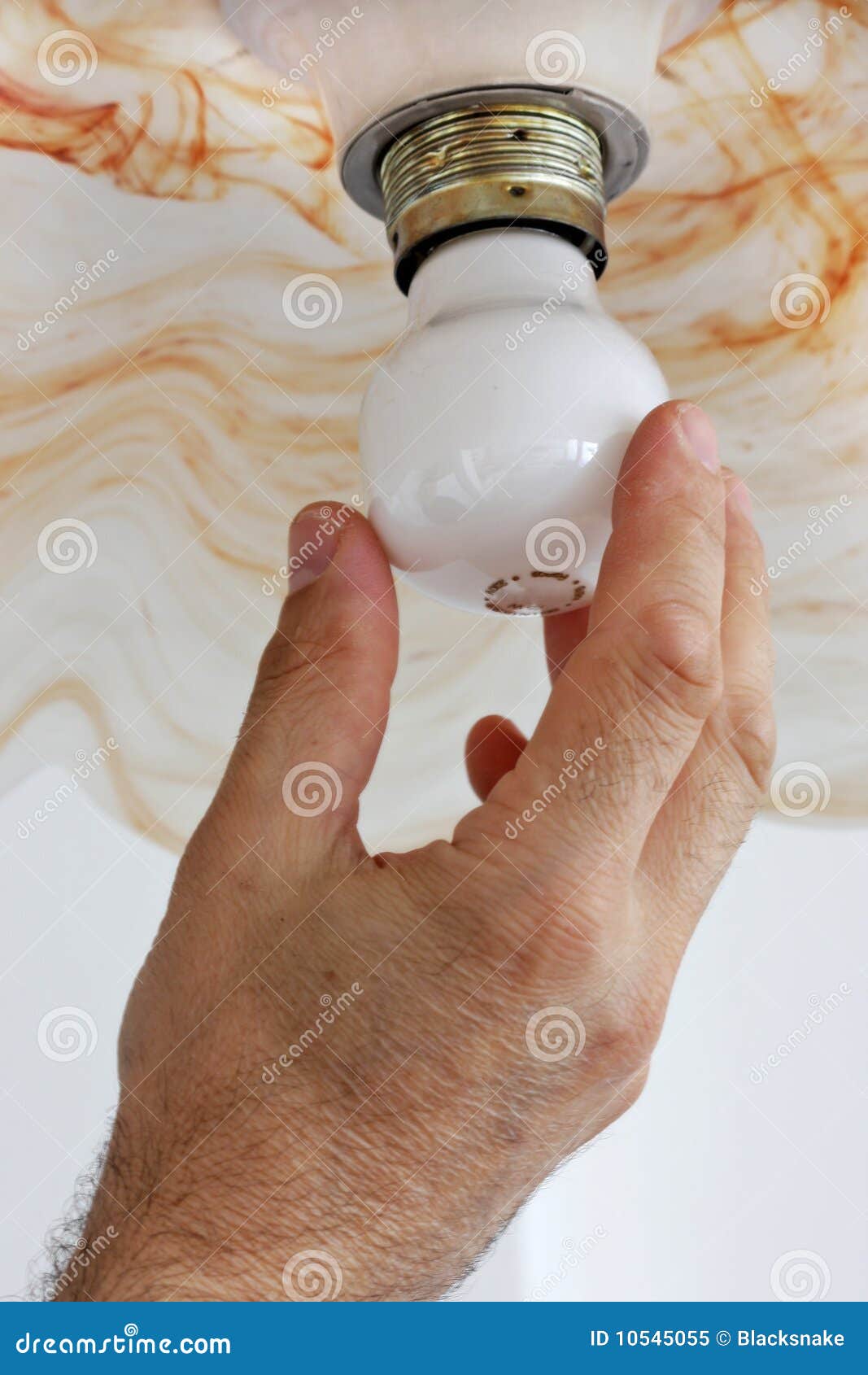 Hand Twisting Electric Light Bulb Stock Image - Image of hand, voltage ...
