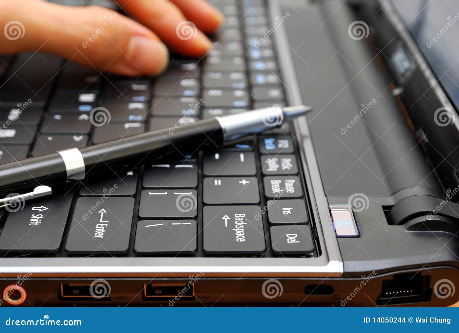 Hand Typing on Laptop with Pen Stock Photo - Image of closeup, black ...