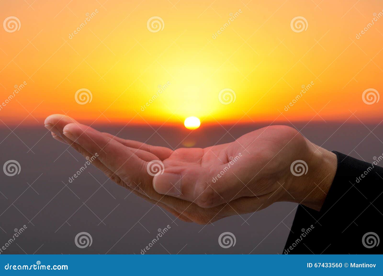 Hand under sunset stock photo. Image of suit, energy - 67433560