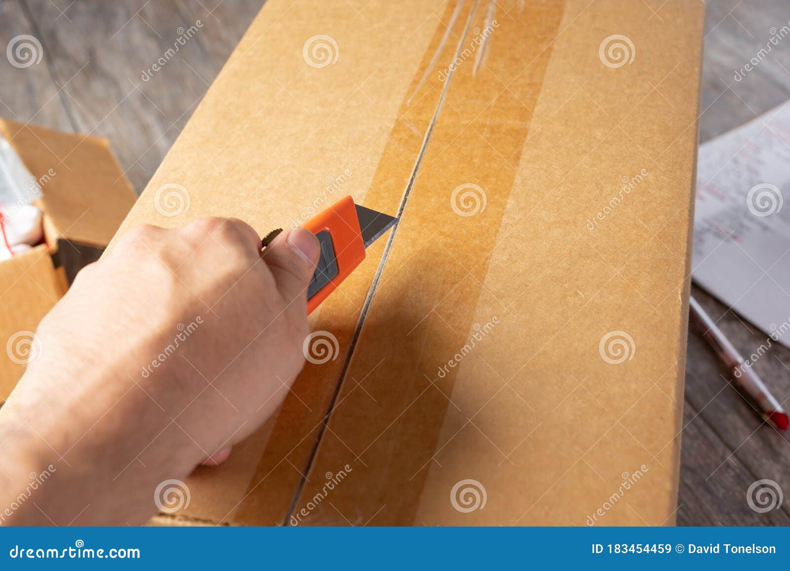 Hand uses box cutter stock image. Image of store, utility - 183454459