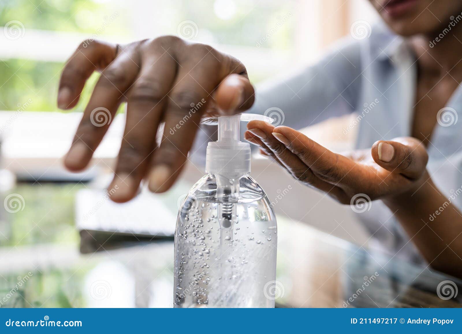 Hand Using Alcohol Rub Gel stock image. Image of hand - 211497217