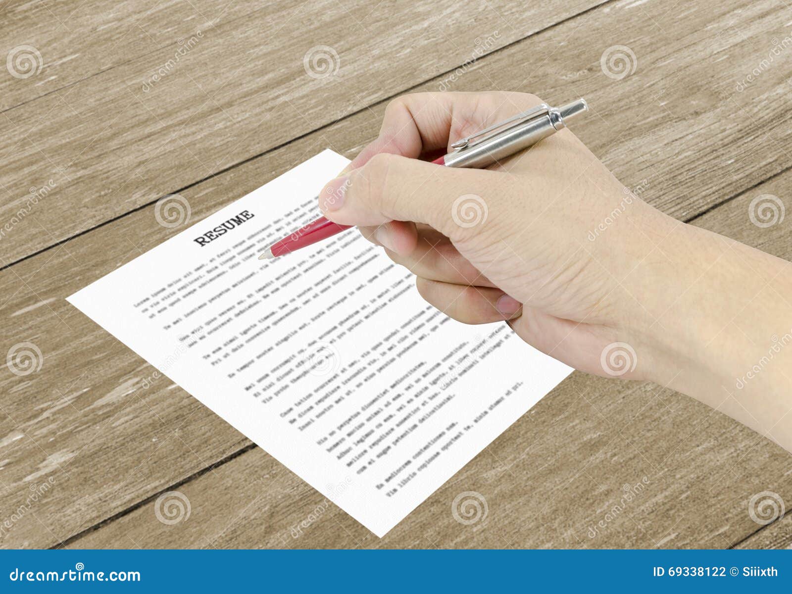 Hand Using a Classic Pen Writing on a Resume Paper Stock Photo - Image ...