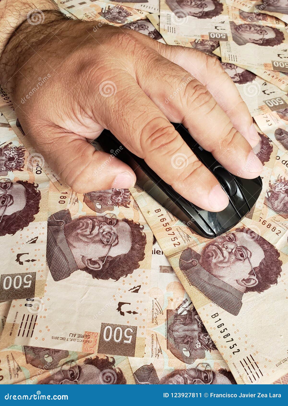 Hand Using a Computer Mouse and Background with Mexican Banknotes of ...