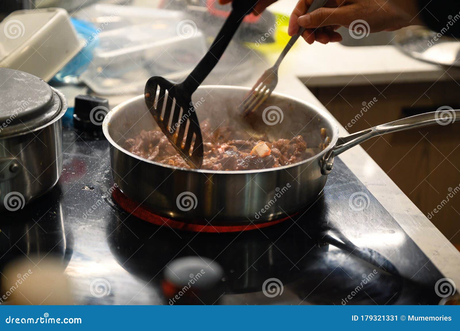 Hand Using Kitchen Flipper Frying Sliced Beef in Pan Stock Image ...