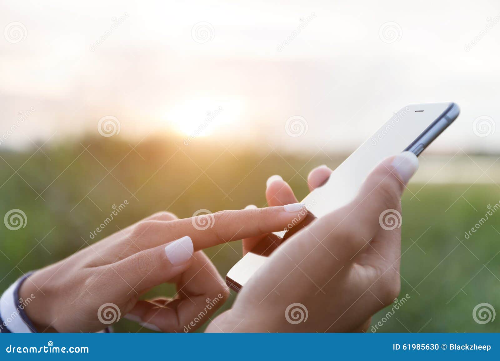 Hand Using Phone Outdoor at Sunset Stock Photo - Image of device ...